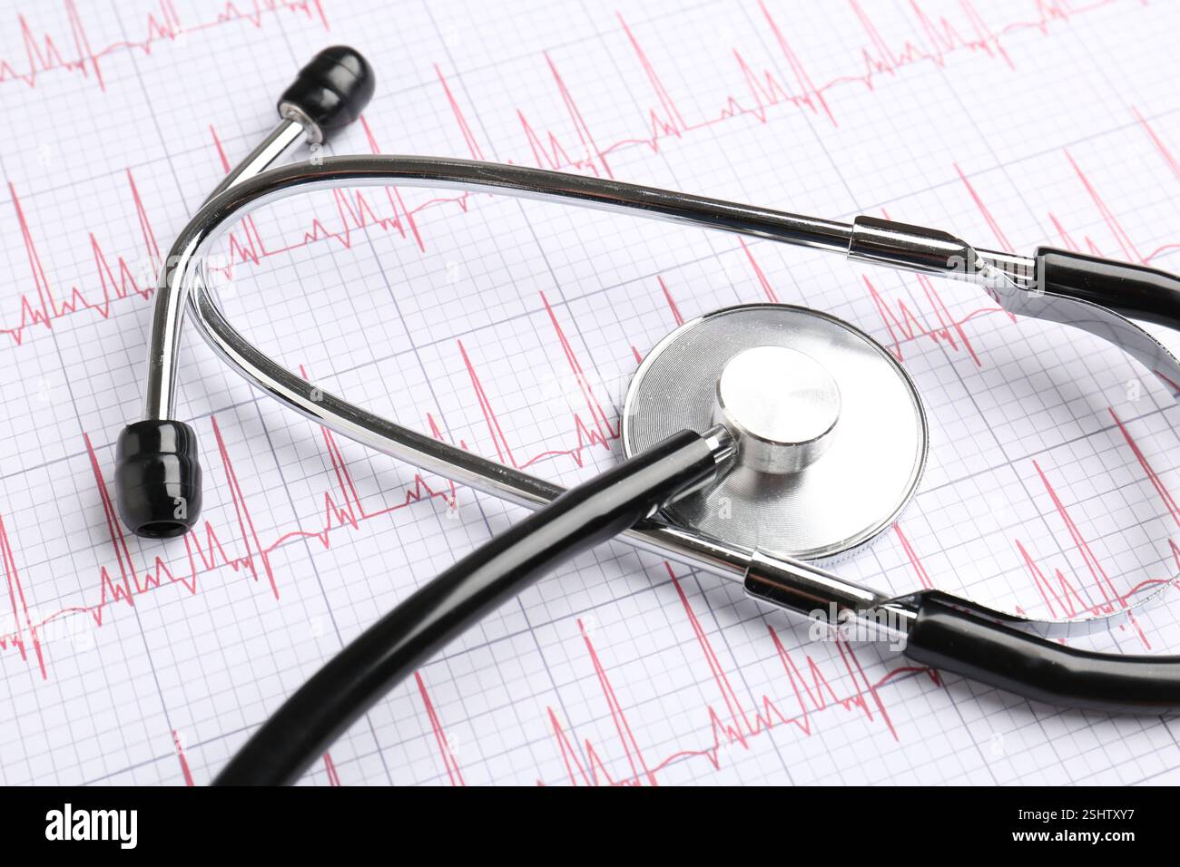 Cardiology. Stethoscope on paper with cardiogram, closeup Stock Photo ...