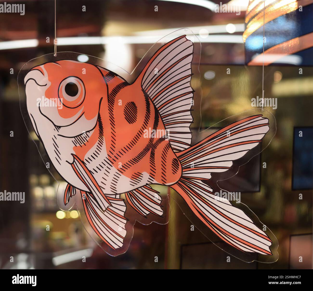 Goldfish ornament on strings Stock Photo - Alamy