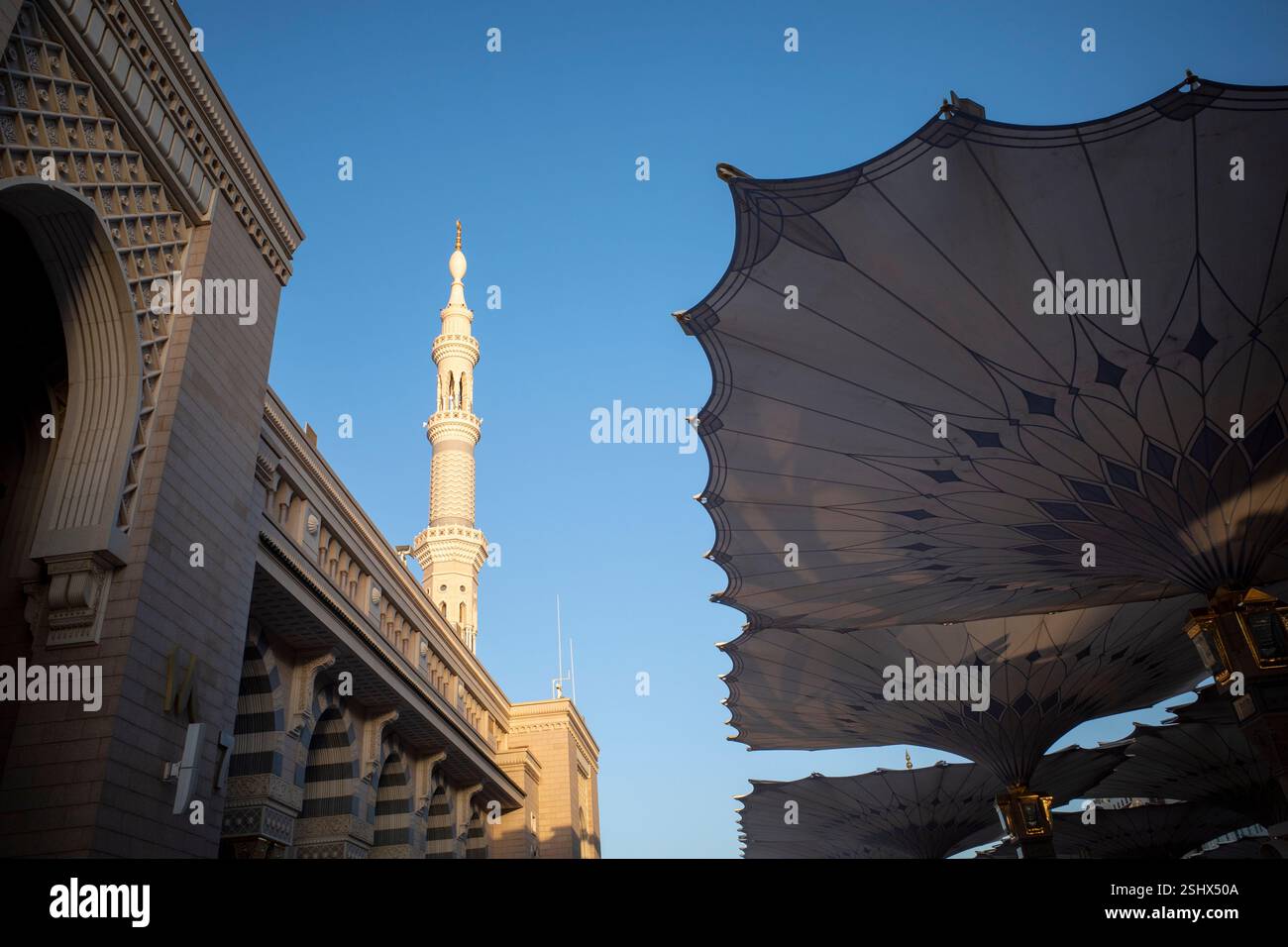 The giant automatic Umbrellas and minarets in Prophet Mosque in Madinah ...