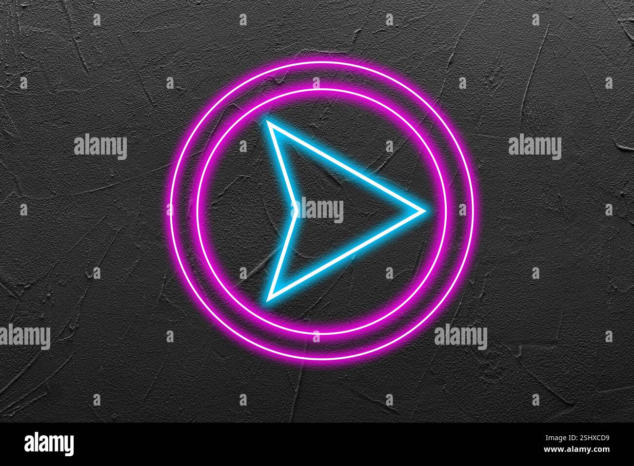 Neon pointer with arrow on grey textured wall Stock Photo - Alamy