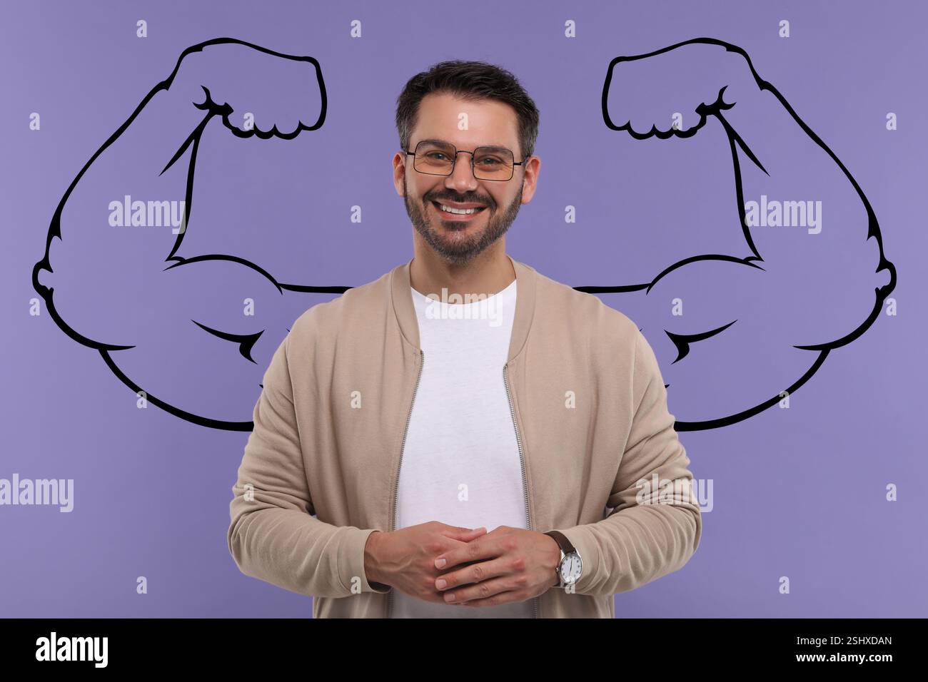 Happy man with drawing of strong arms behind him on dark violet ...
