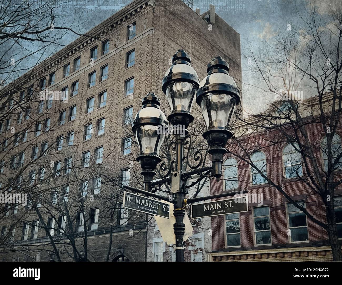 Antique iron streetlight with street names on the crossroads in ...