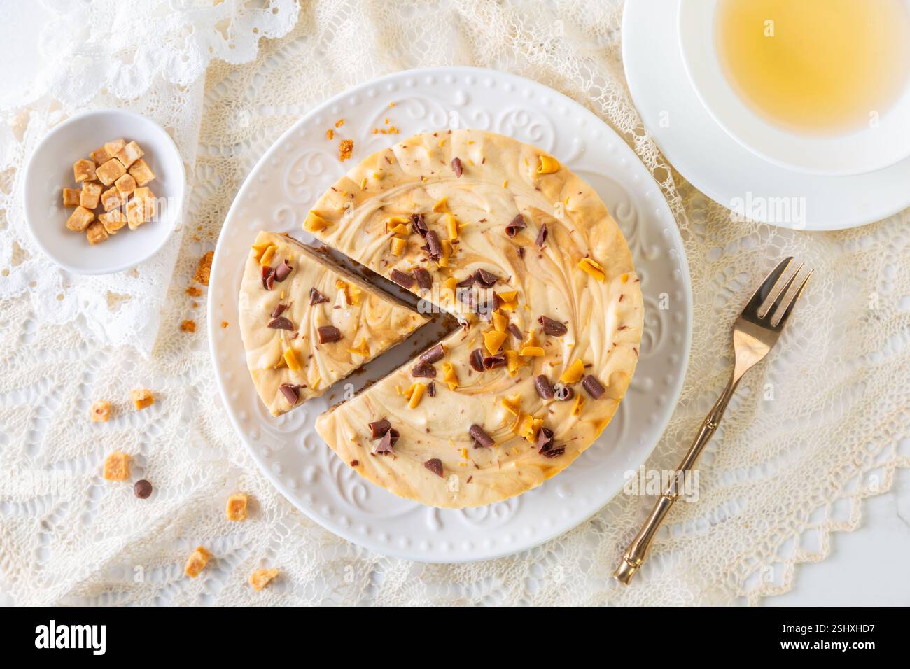 Salted caramel cheesecake with cup of tea Stock Photo - Alamy