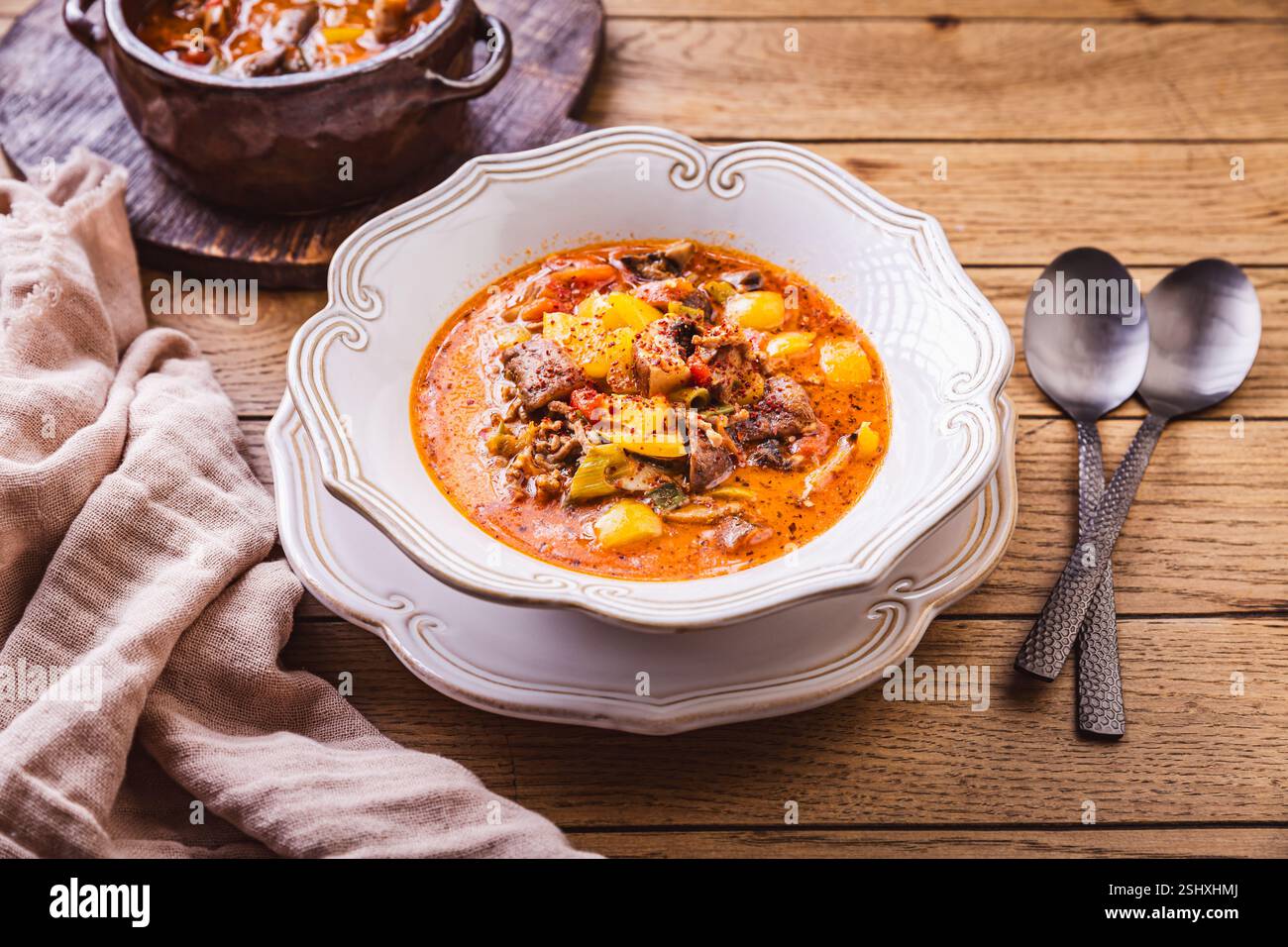 Zero waste soup, pizza soup with vegetables, mushrooms and minced meat ...