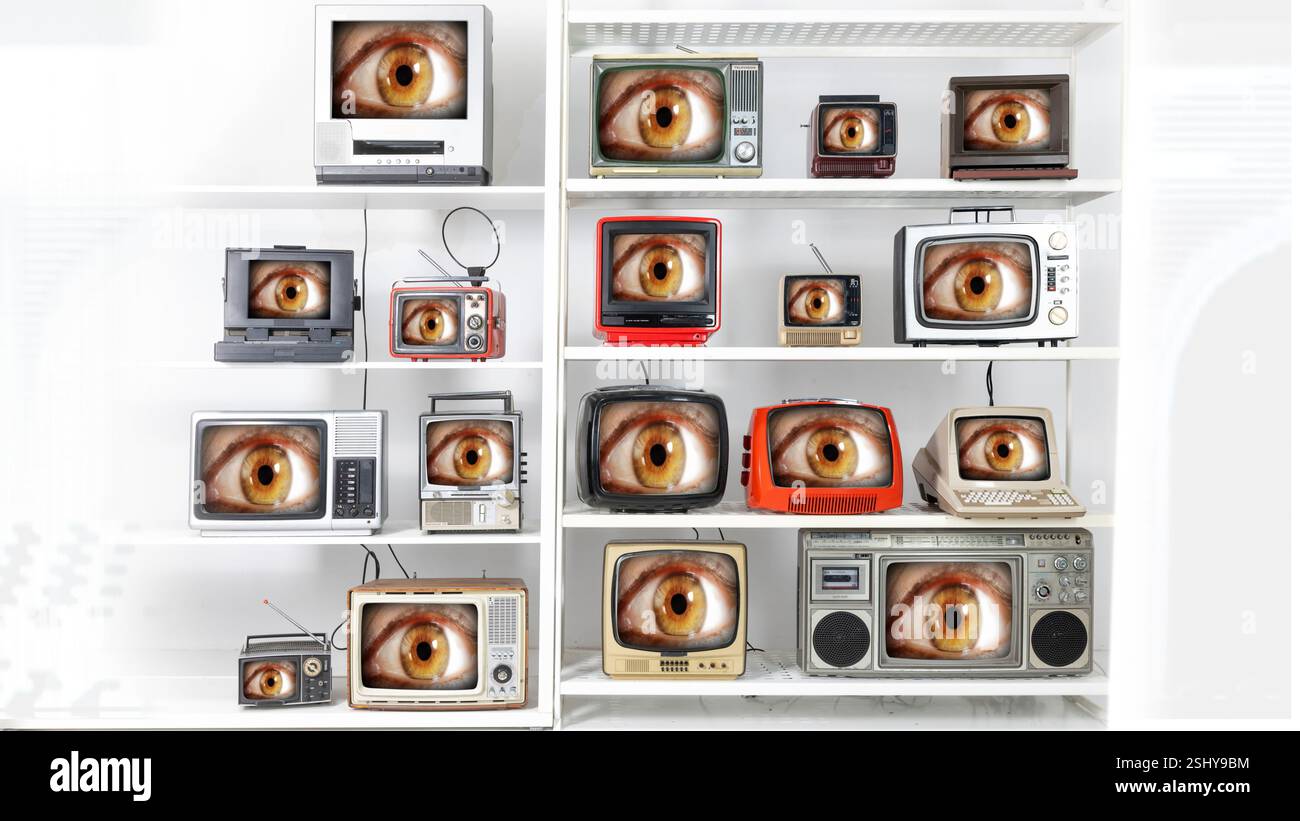 Collection of retro televisions with eyes in the screen Stock Photo - Alamy