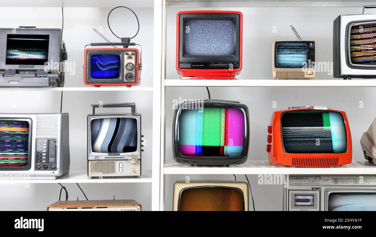 collection of old televisions with glitch and distortion on the screens ...