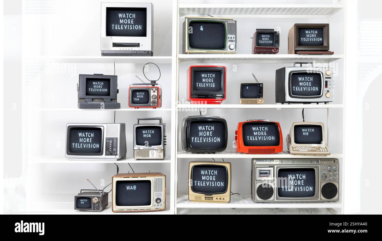 collection of old televisions with screen time warning Stock Photo - Alamy