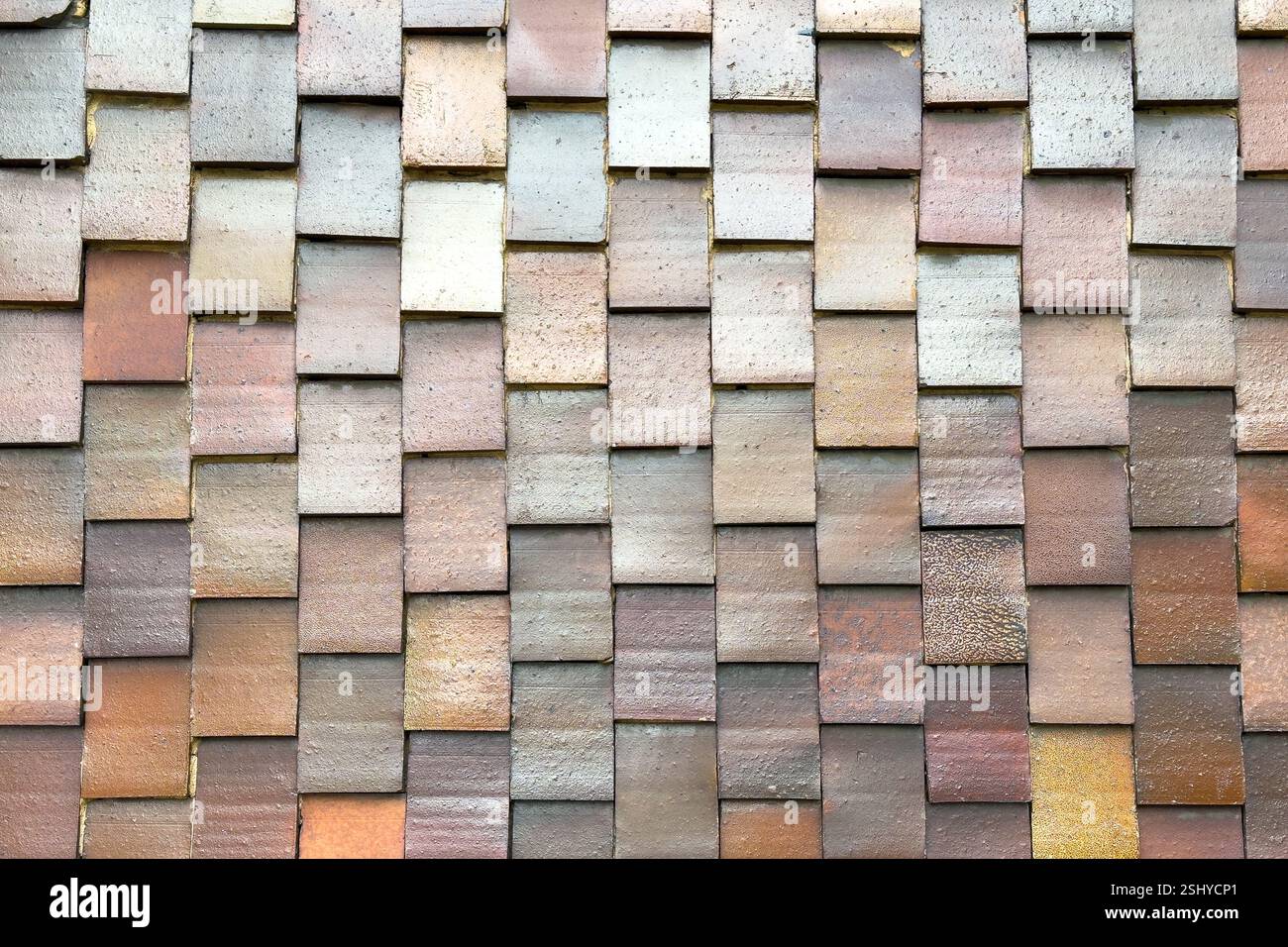 Layered multicolor tiled wall structure with overlapping rectangular ...