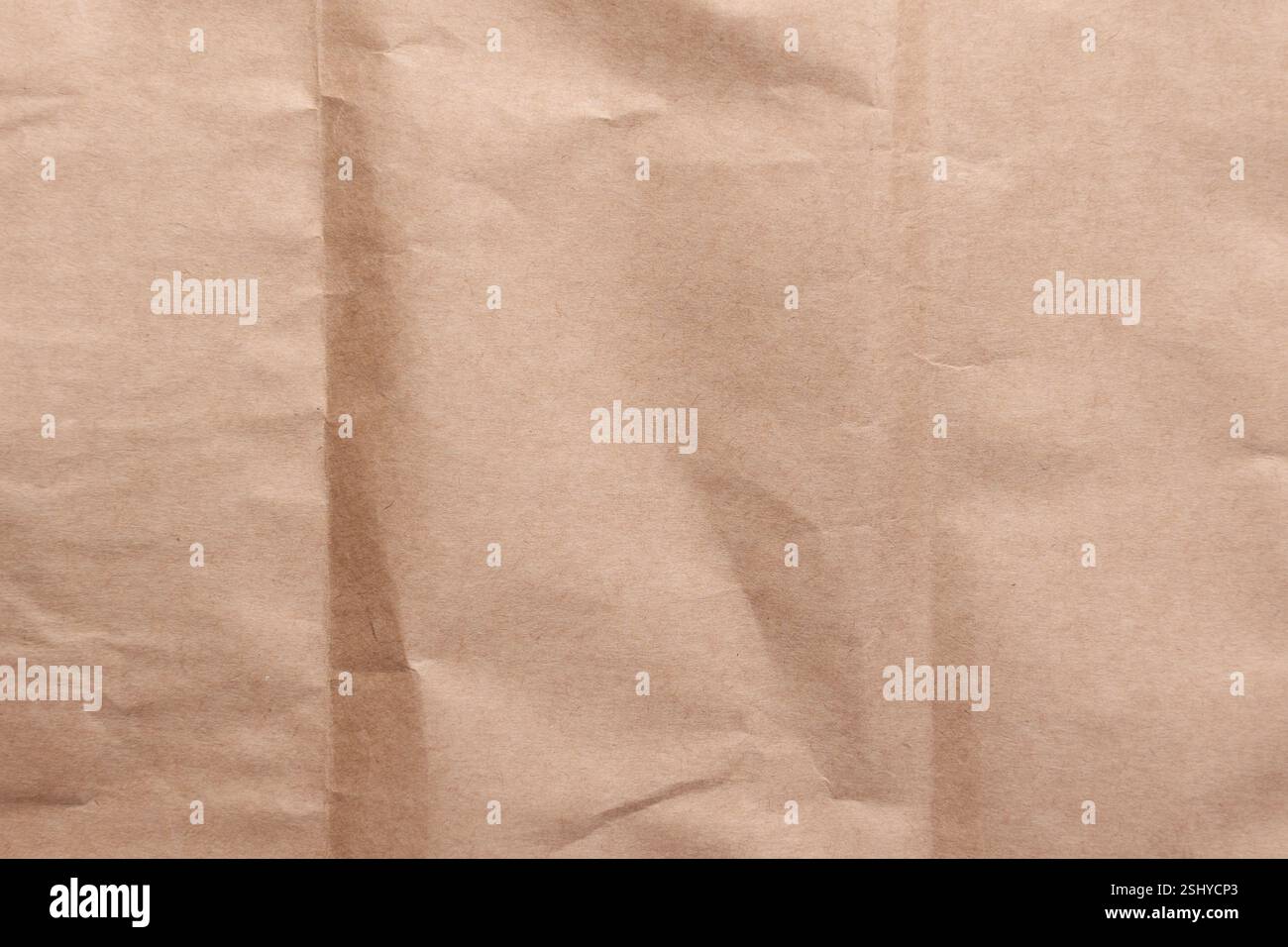 Folded wrinkled brown paper background. Crumpled abstract backdrop. Old ...