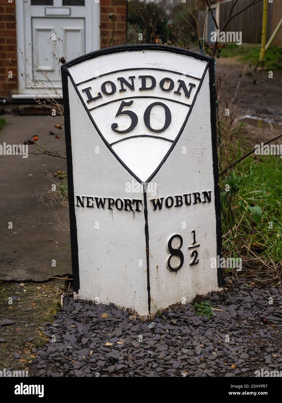 Old English milestone, Newport Pagnell, Buckinghamshire, UK; showing ...