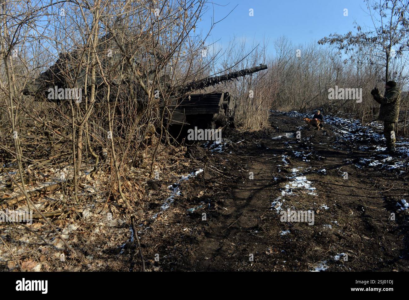 DONETSK REGION, UKRAINE - FEBRUARY 9, 2025 - Soldiers stay by a tank as ...