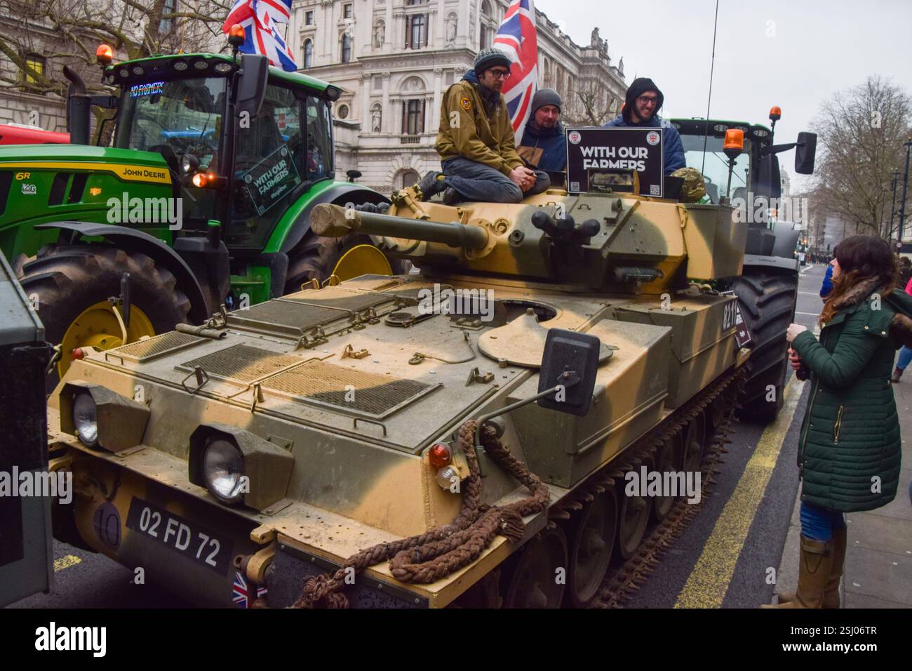 London, UK. 10th February 2025. Protesters sit on a tank in Whitehall ...