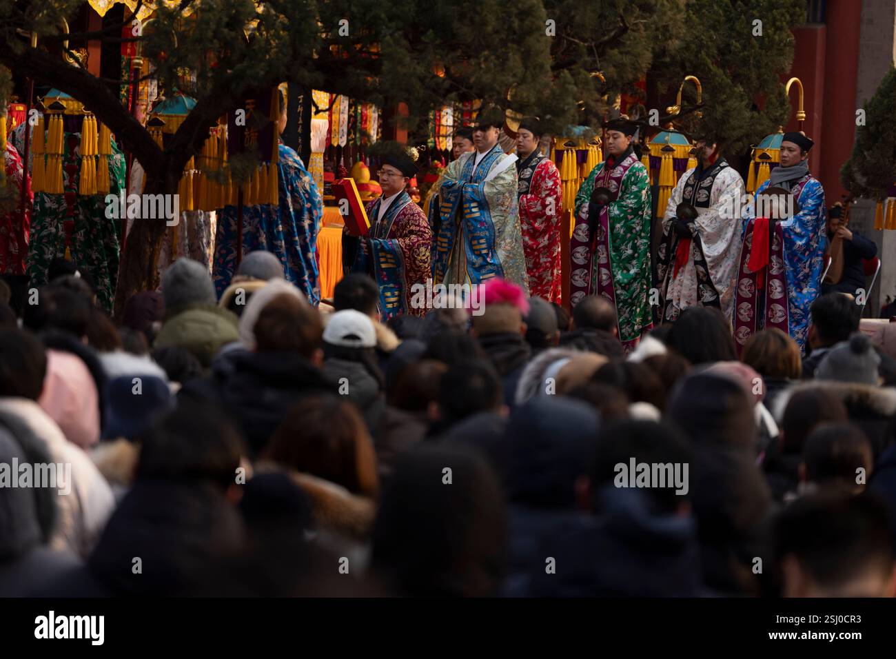 Taoist priests perform a ritual on a day when faithfuls seek blessings ...