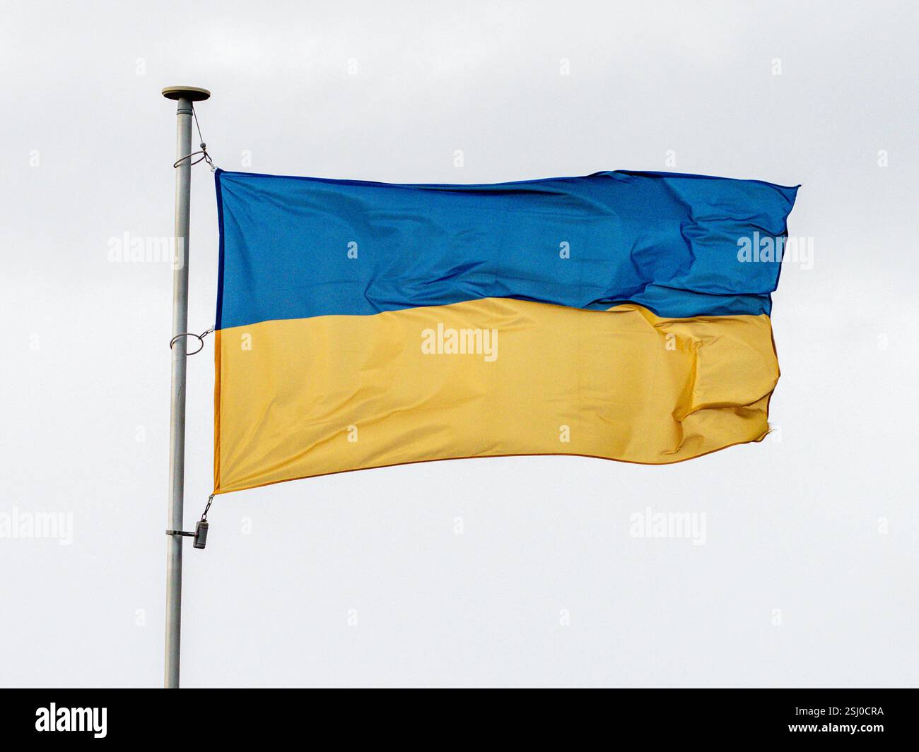 ukraine flag. A Ukrainian blue yellow flag waves on the sky background ...