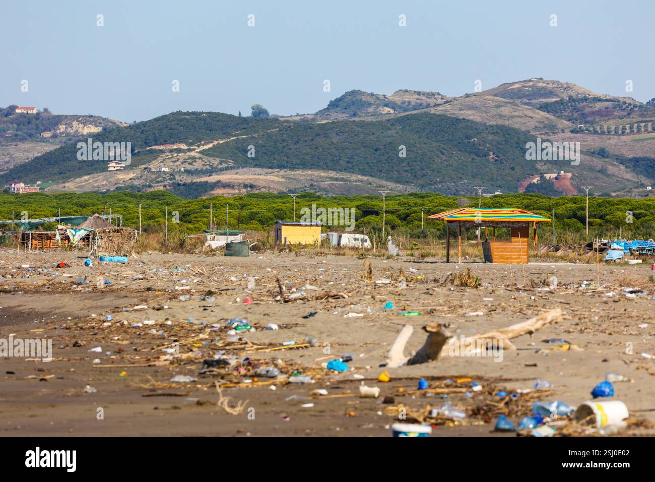 sandy beach of Buona Vila in Albania littered with garbage, plastic ...