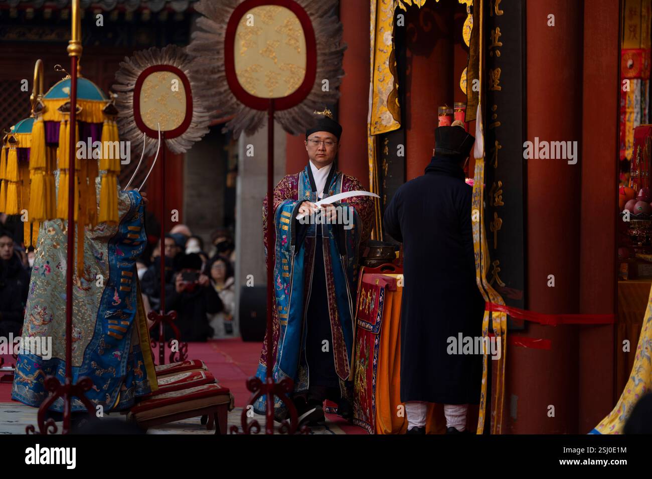 Taoist priests perform a ritual on a day when faithfuls seek blessings ...