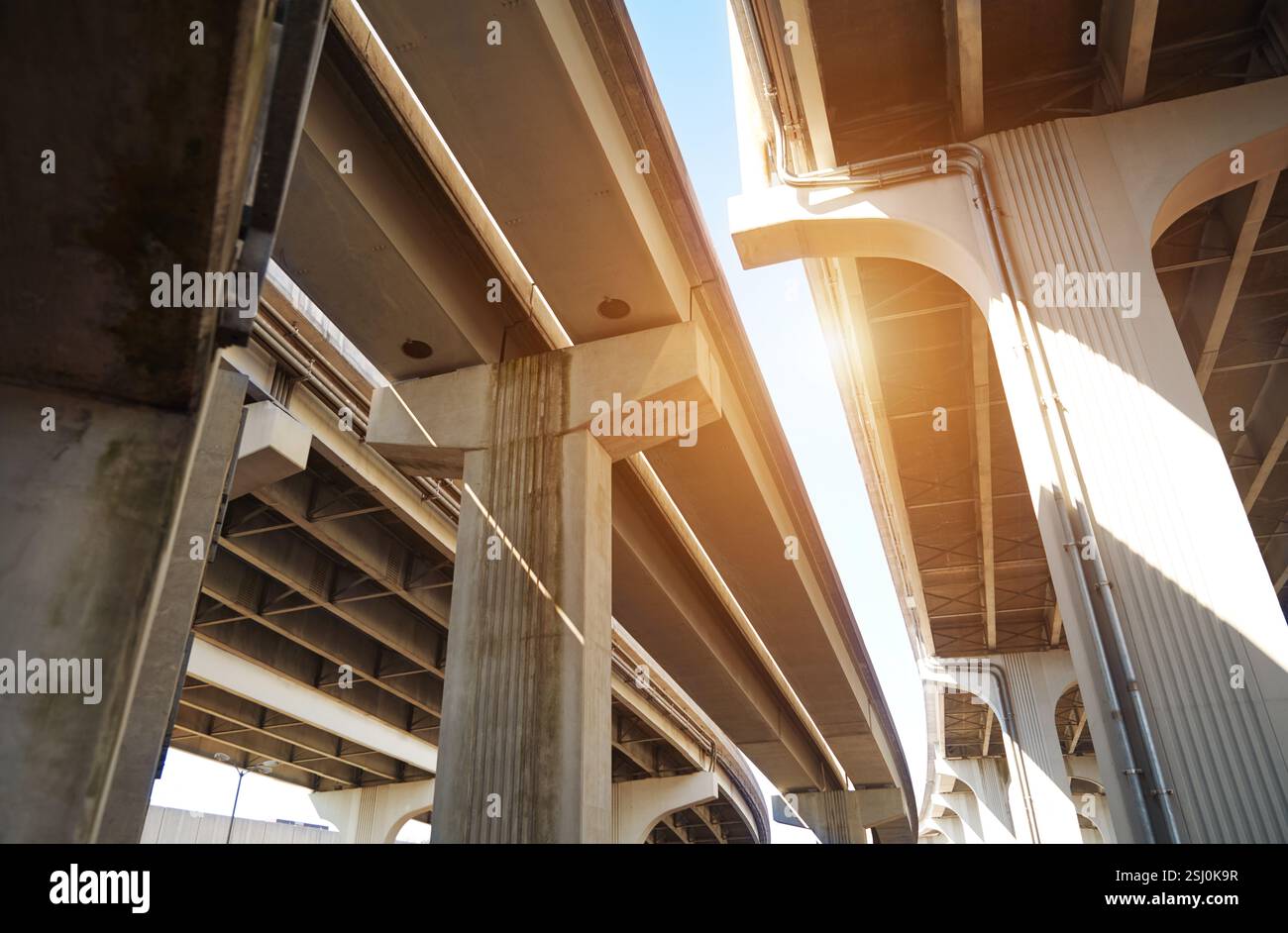 Underneath a highway bridge with sunlight Stock Photo - Alamy
