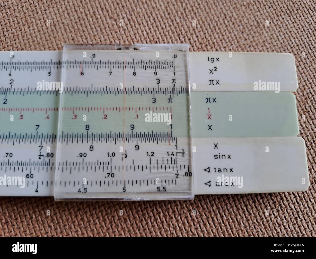 Slide rule old manual tool for calculation Stock Photo - Alamy
