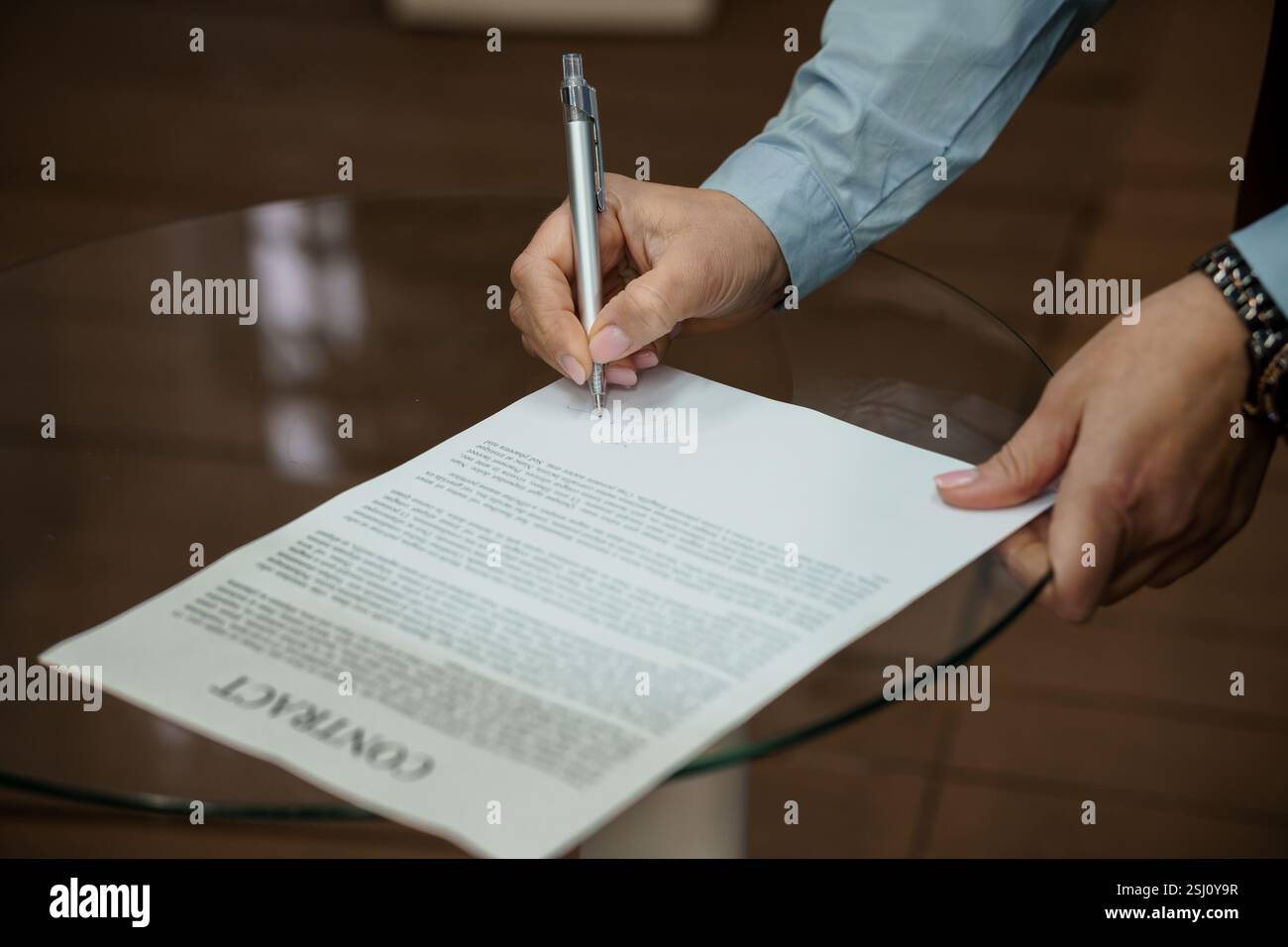 Signing a Legal Contract with Confidence in a Modern Office Setting ...