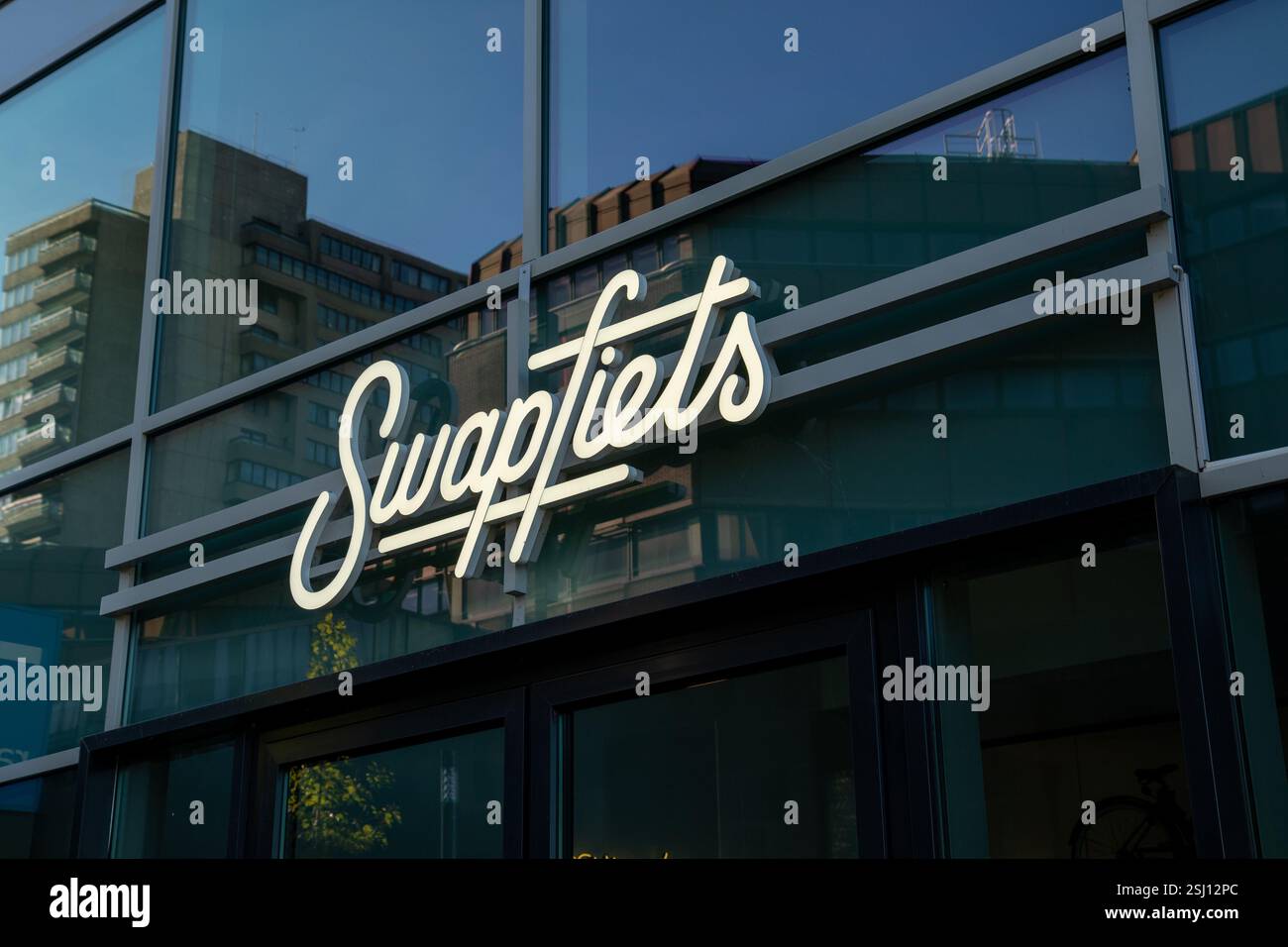 Swapfiets Flagship bike Store, shop sign above the entrance Stock Photo - Alamy
