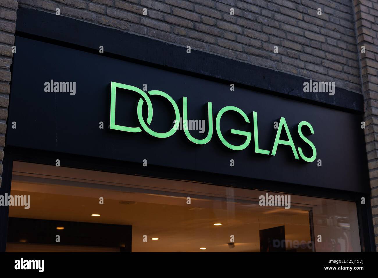 Douglas store front, shop window with illuminated logo. Douglas is the ...
