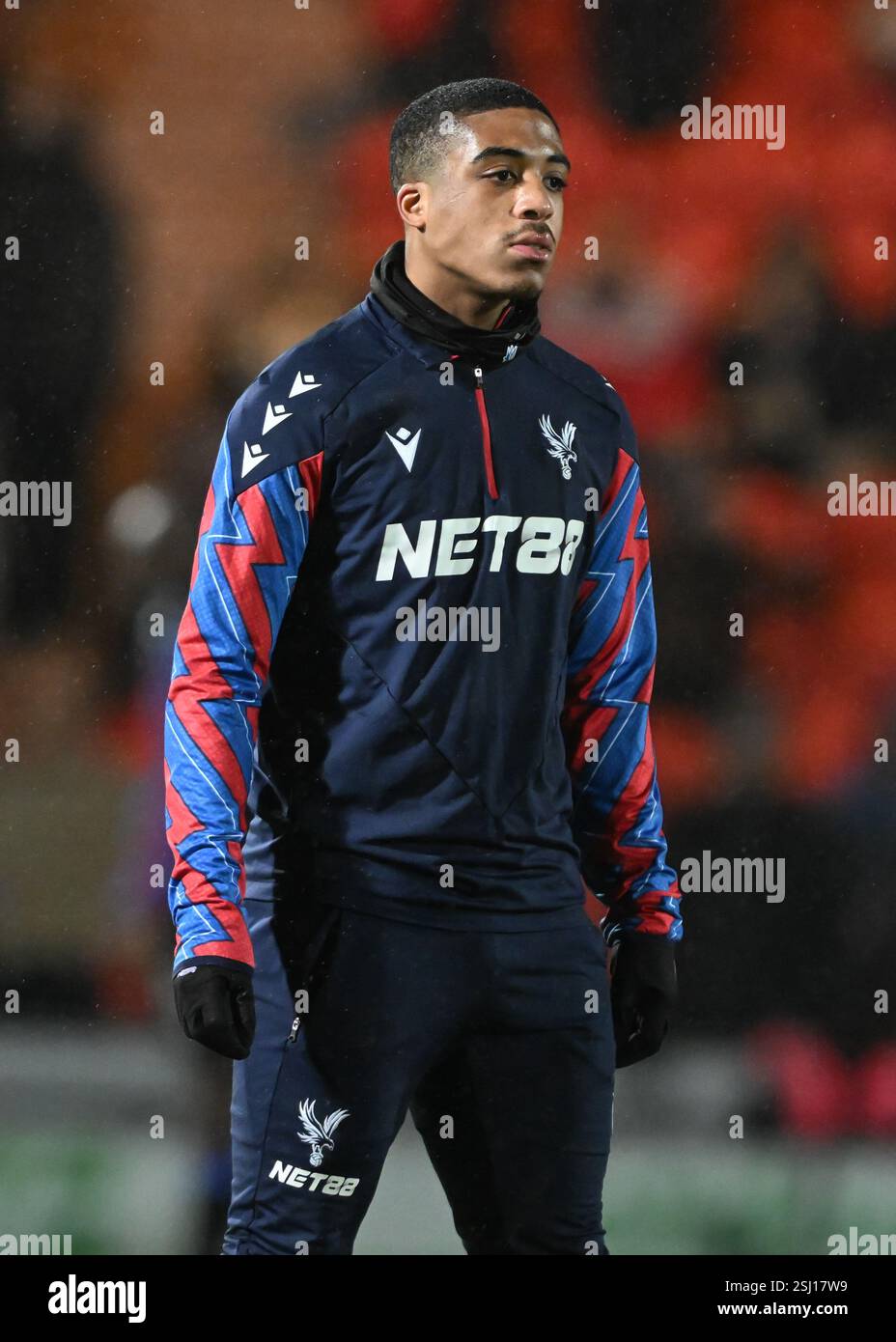 Doncaster, UK. 10th Feb, 2025. Caleb Kporha of Crystal Palace warms up ...