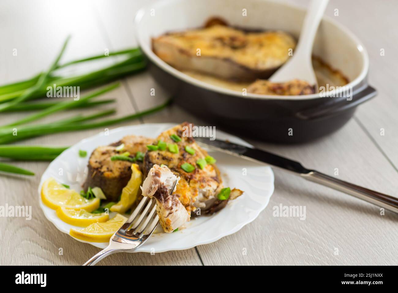 Gourmet dinner with juicy fish Stock Photo - Alamy