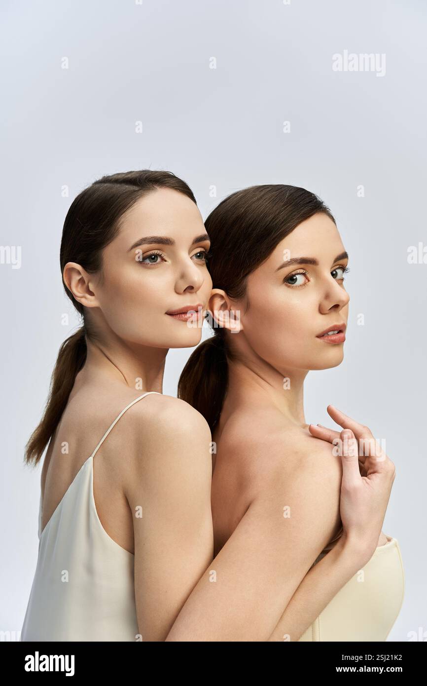 Two beautiful sisters showcase their strong connection while posing ...