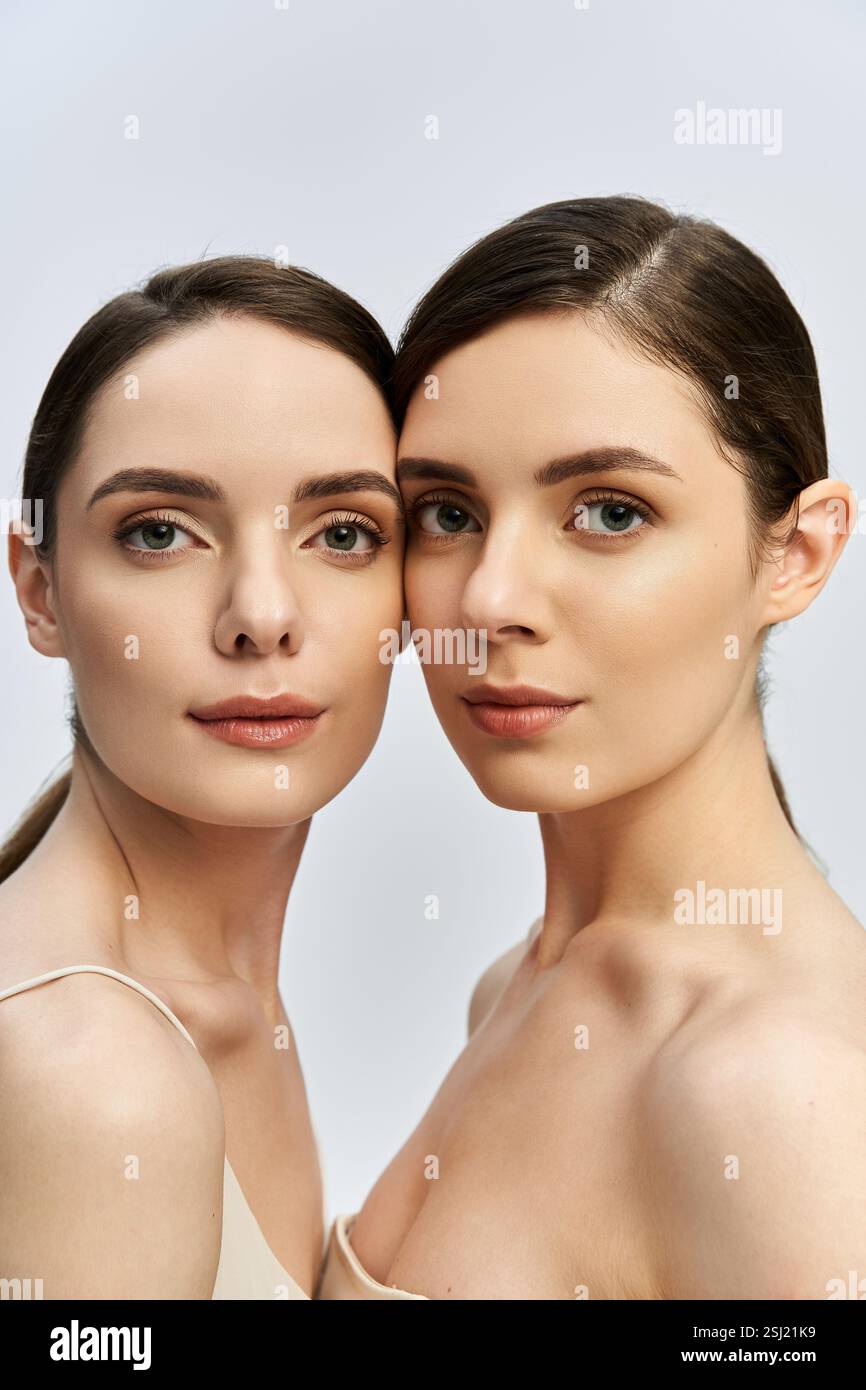 Two women pose gracefully eyes hi-res stock photography and images - Alamy
