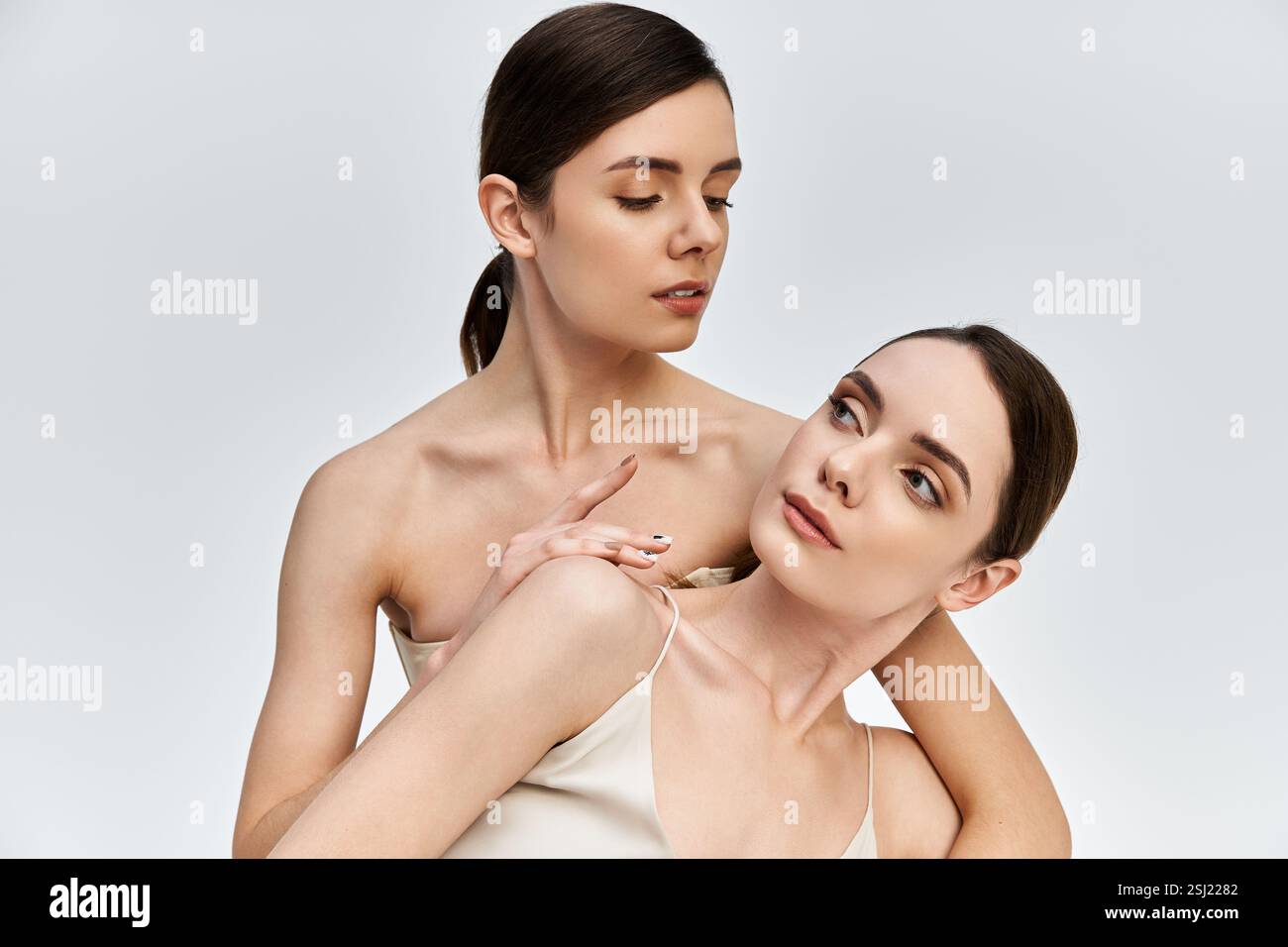 Two beautiful sisters portray elegance and unity, capturing a special ...