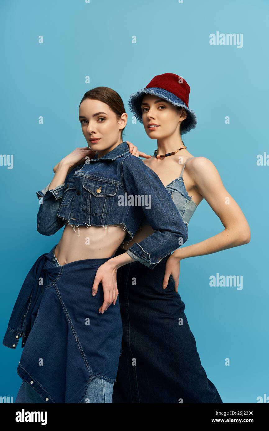 Two pretty twin sisters shine in fashionable denim, showing their ...
