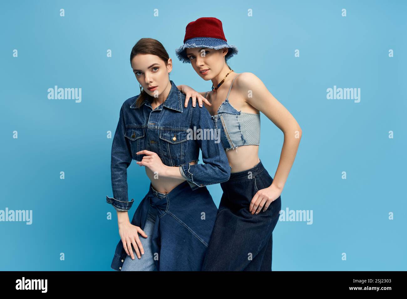 Twins pose confidently in chic denim outfits, highlighting their ...