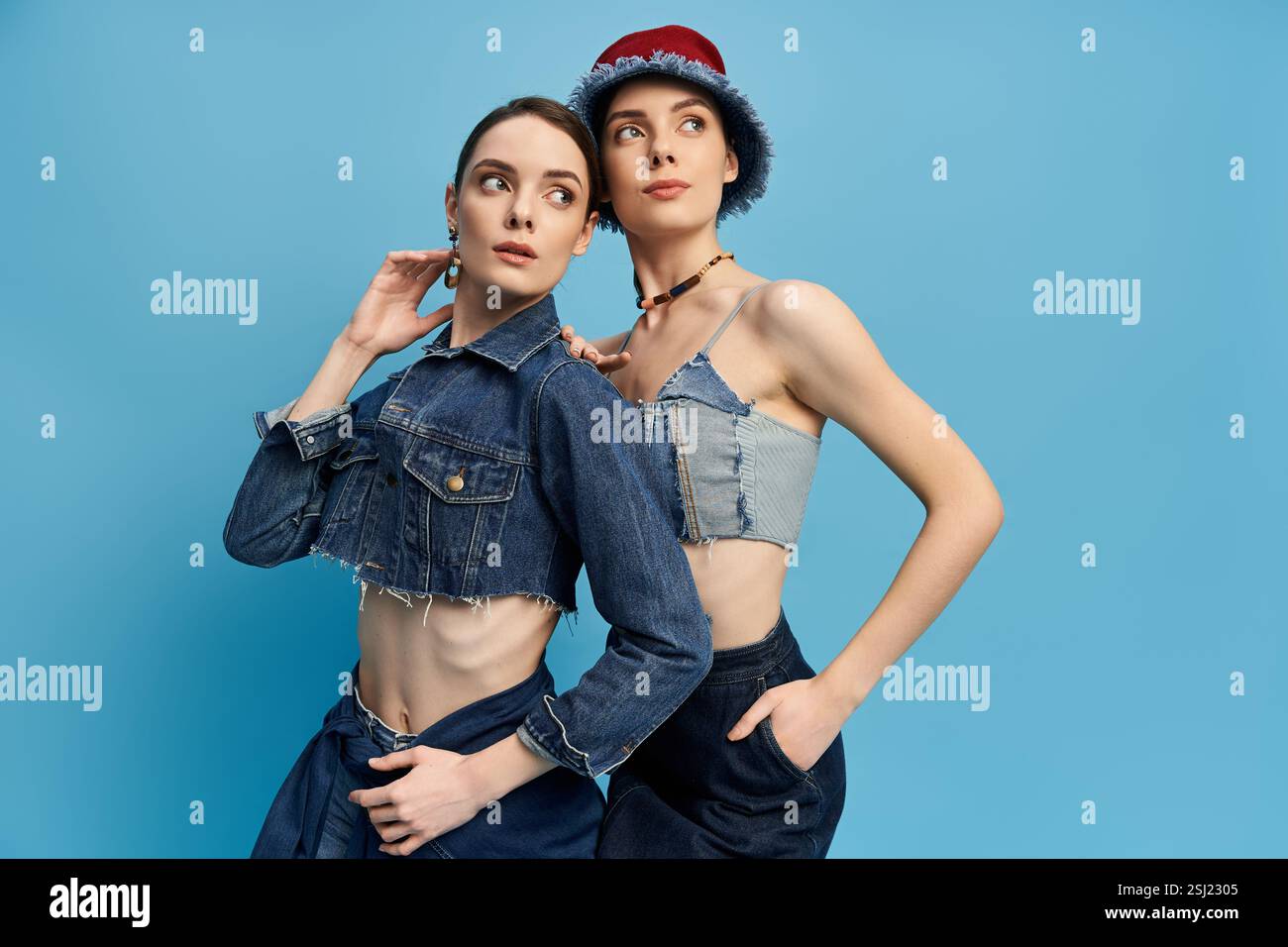 Two stunning twin sisters pose elegantly, showing off their chic ...