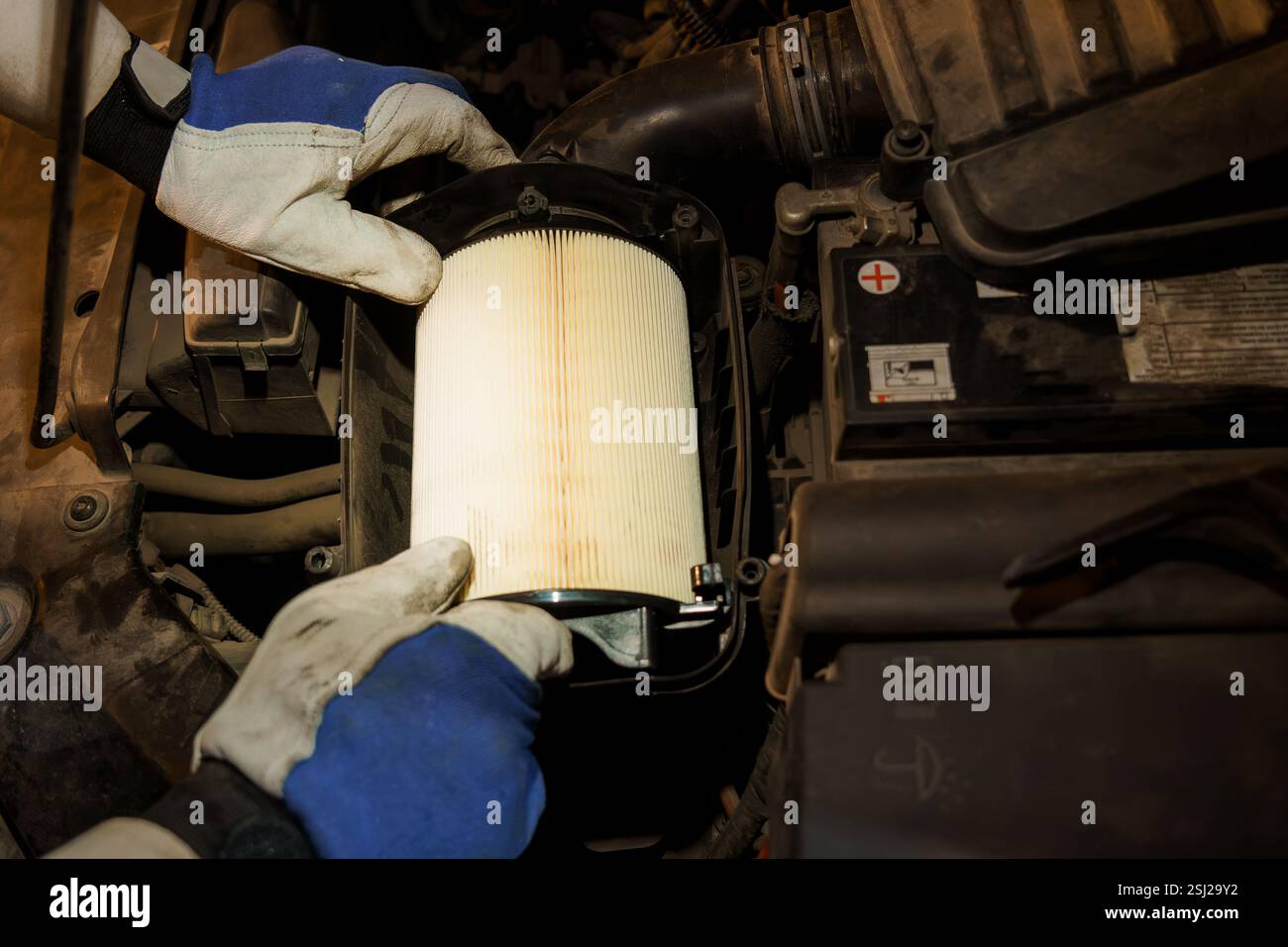 Car Maintenance: Changing the Air Filter in an Automobile Engine ...