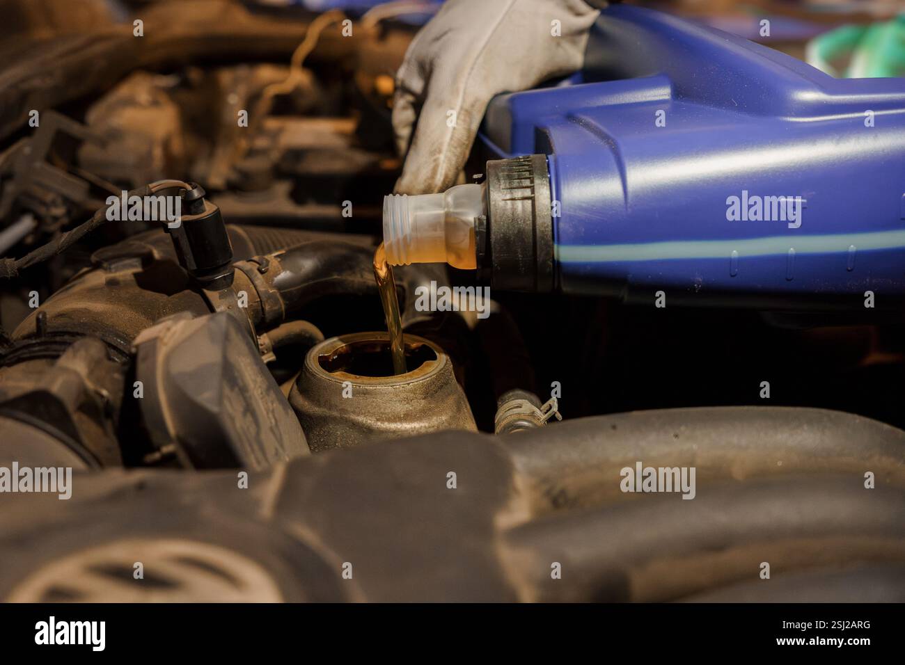 Car Maintenance: Adding Engine Oil to a Vehicle Stock Photo - Alamy