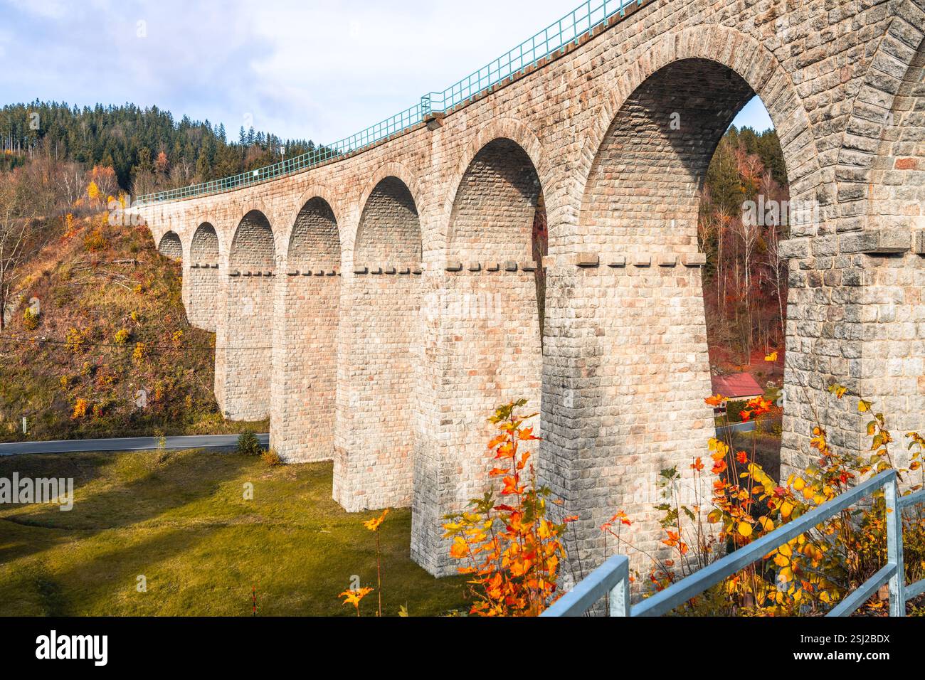 The elegant railway viaduct arches gracefully across the landscape in ...
