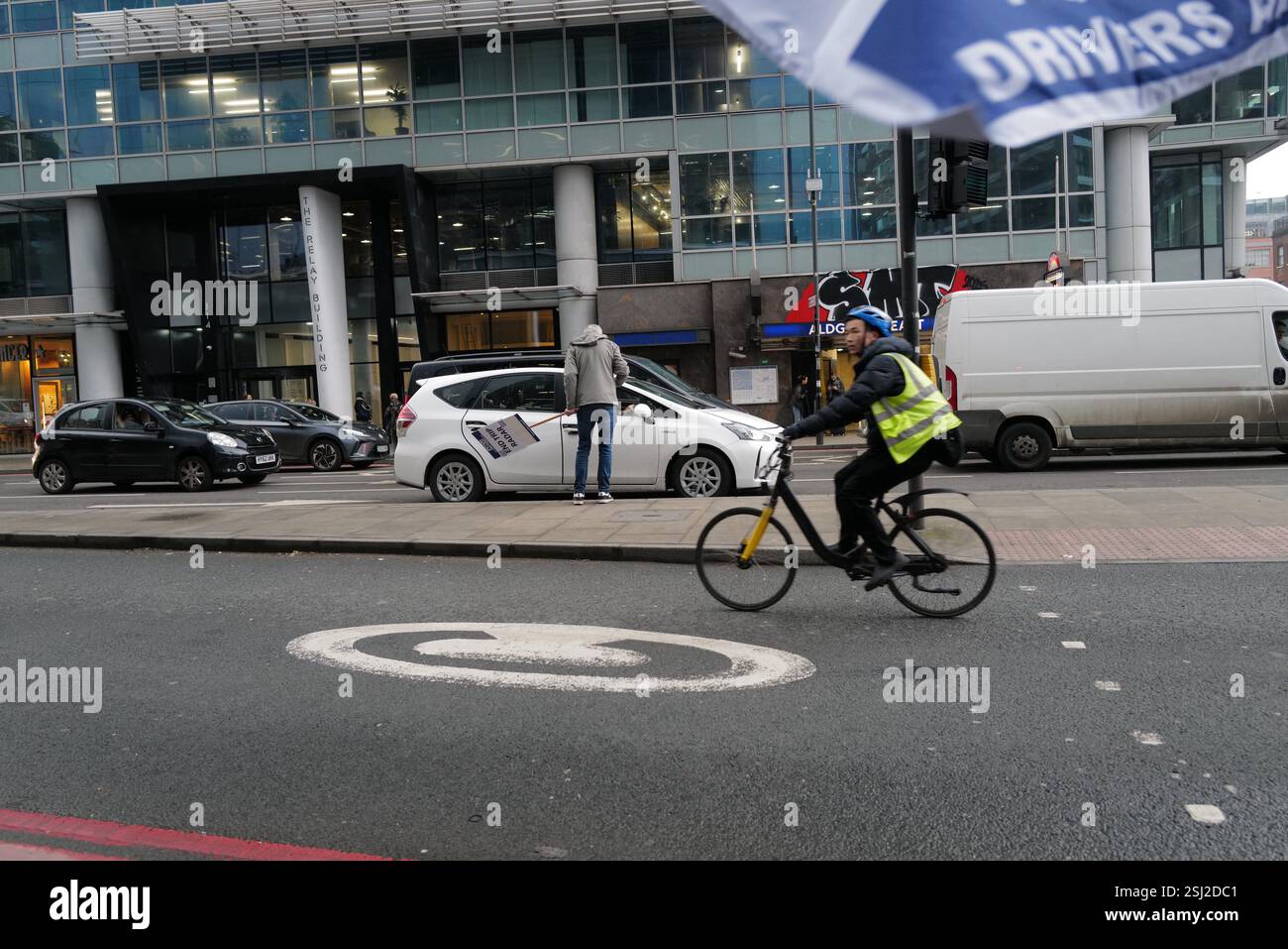 Members of the App Drivers & Couriers Union assemble at Aldgate Tower ...