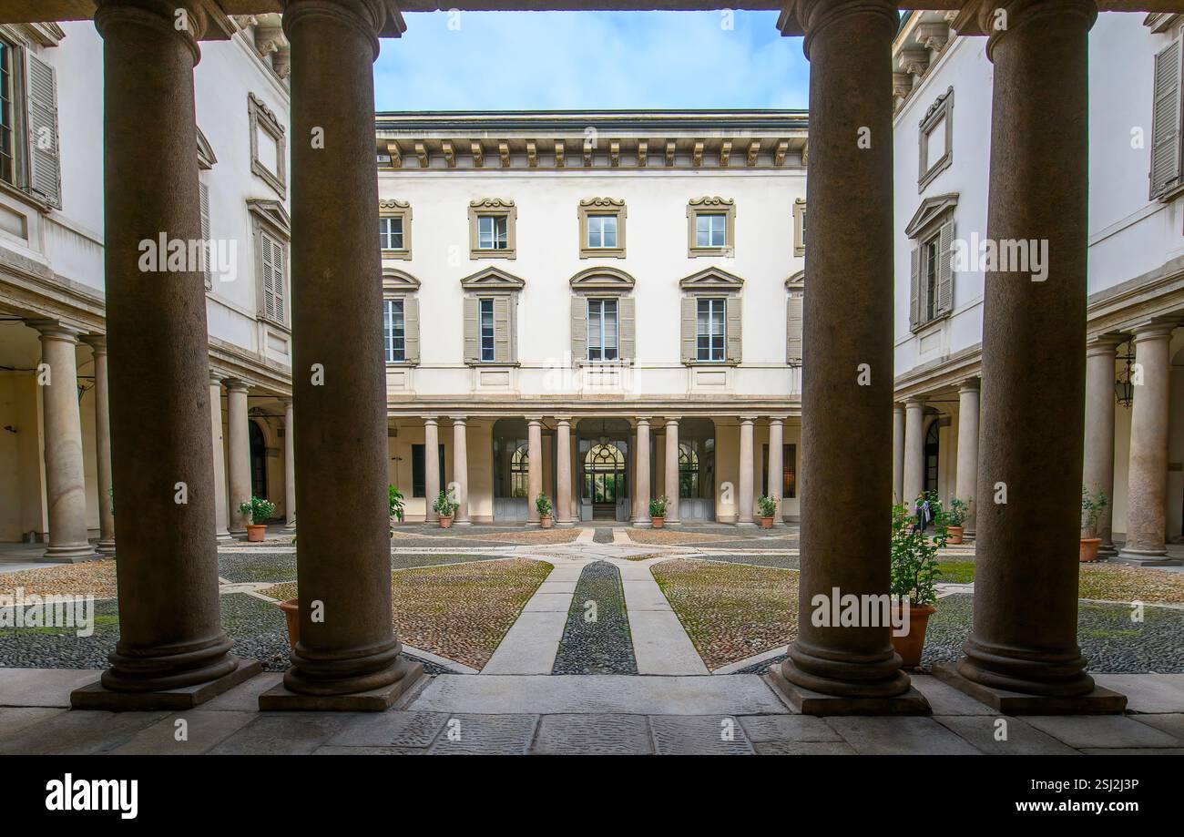 Milan, Italy. Traditional colorful building with balconies, shutter ...