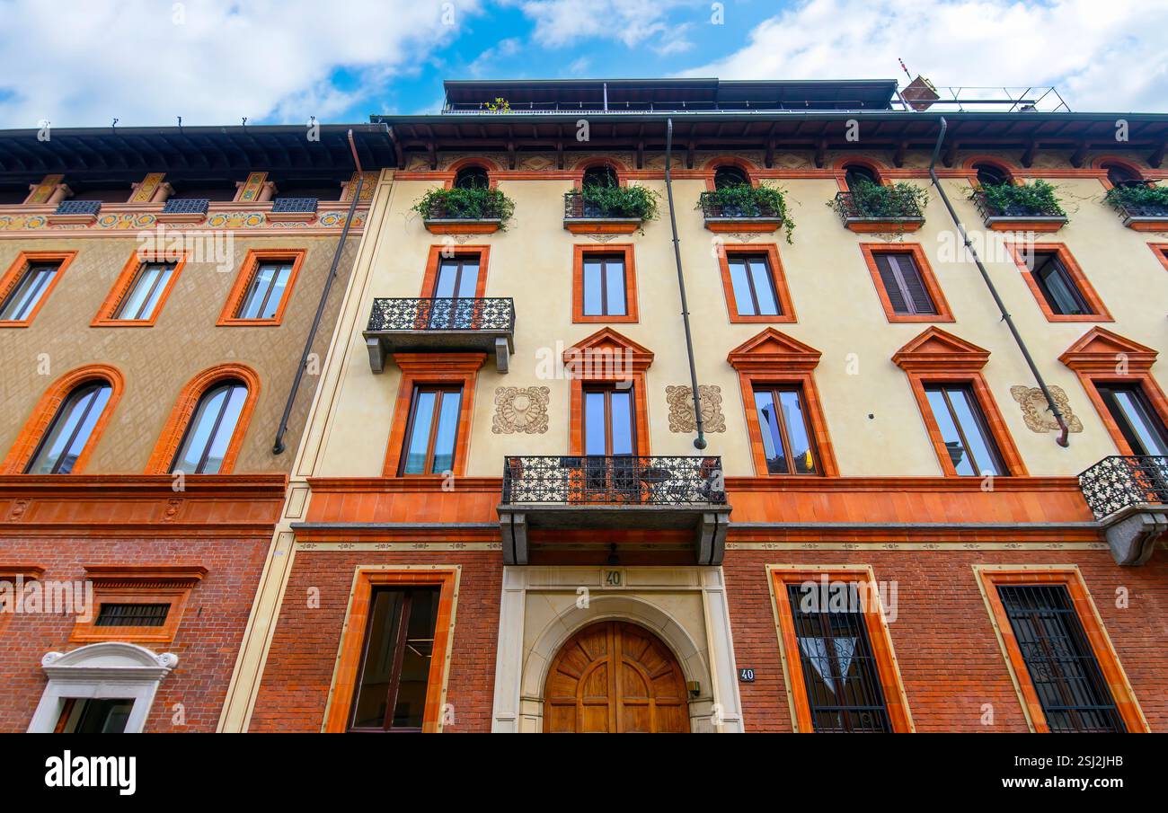 Milan, Italy. Traditional colorful building with balconies, shutter ...