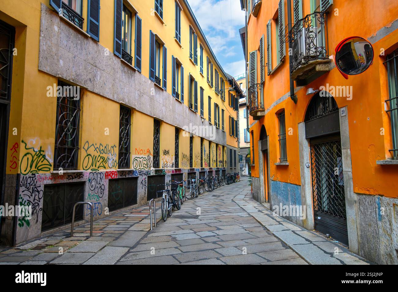 Milan, Italy. Traditional colorful building with balconies, shutter ...