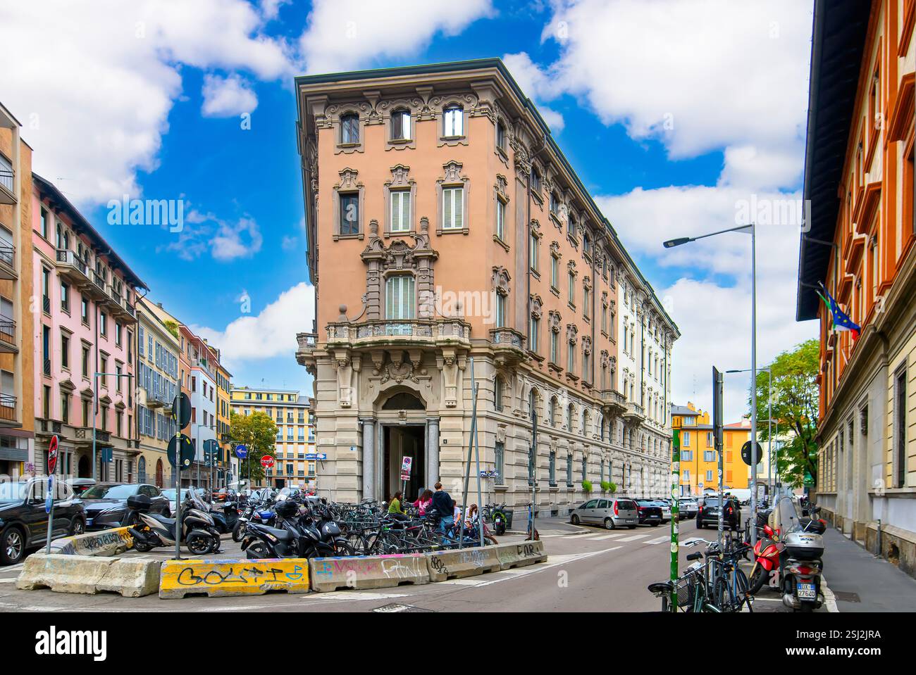 Milan, Italy. Traditional colorful building with balconies, shutter ...