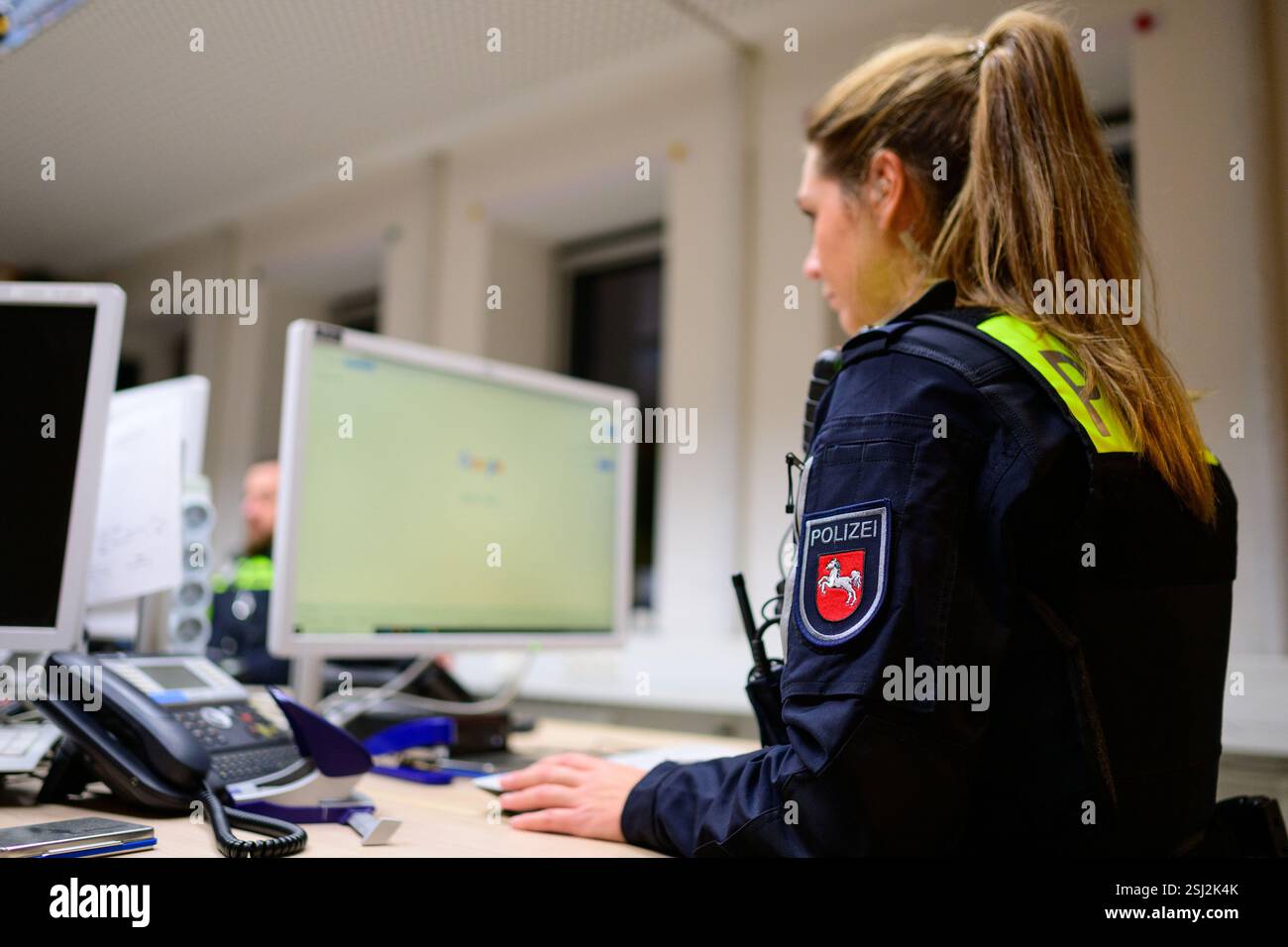26 September 2022, Lower Saxony, Lüneburg: A policewoman works on the ...