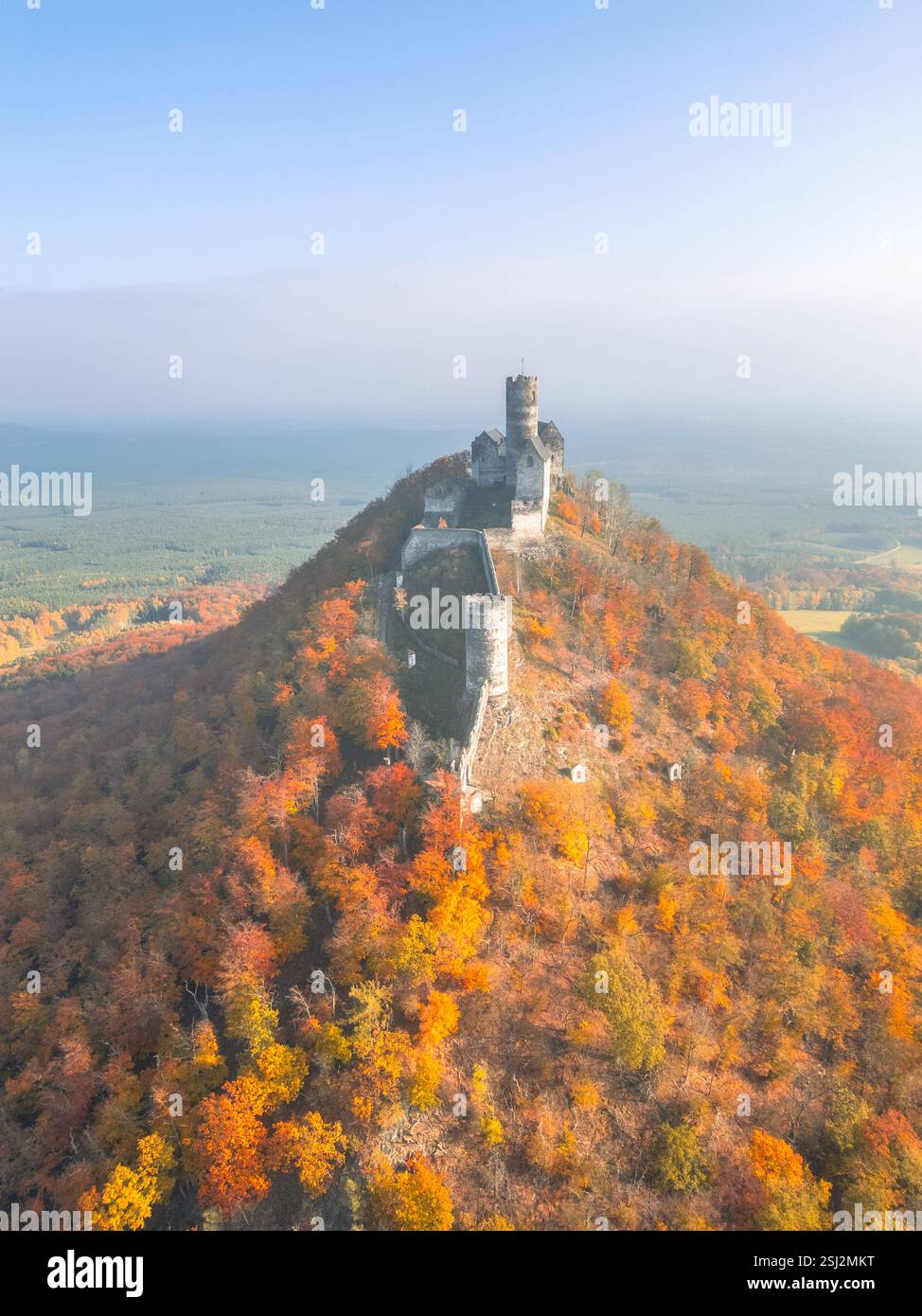 The medieval Bezdez castle stands majestically atop a hill, surrounded ...