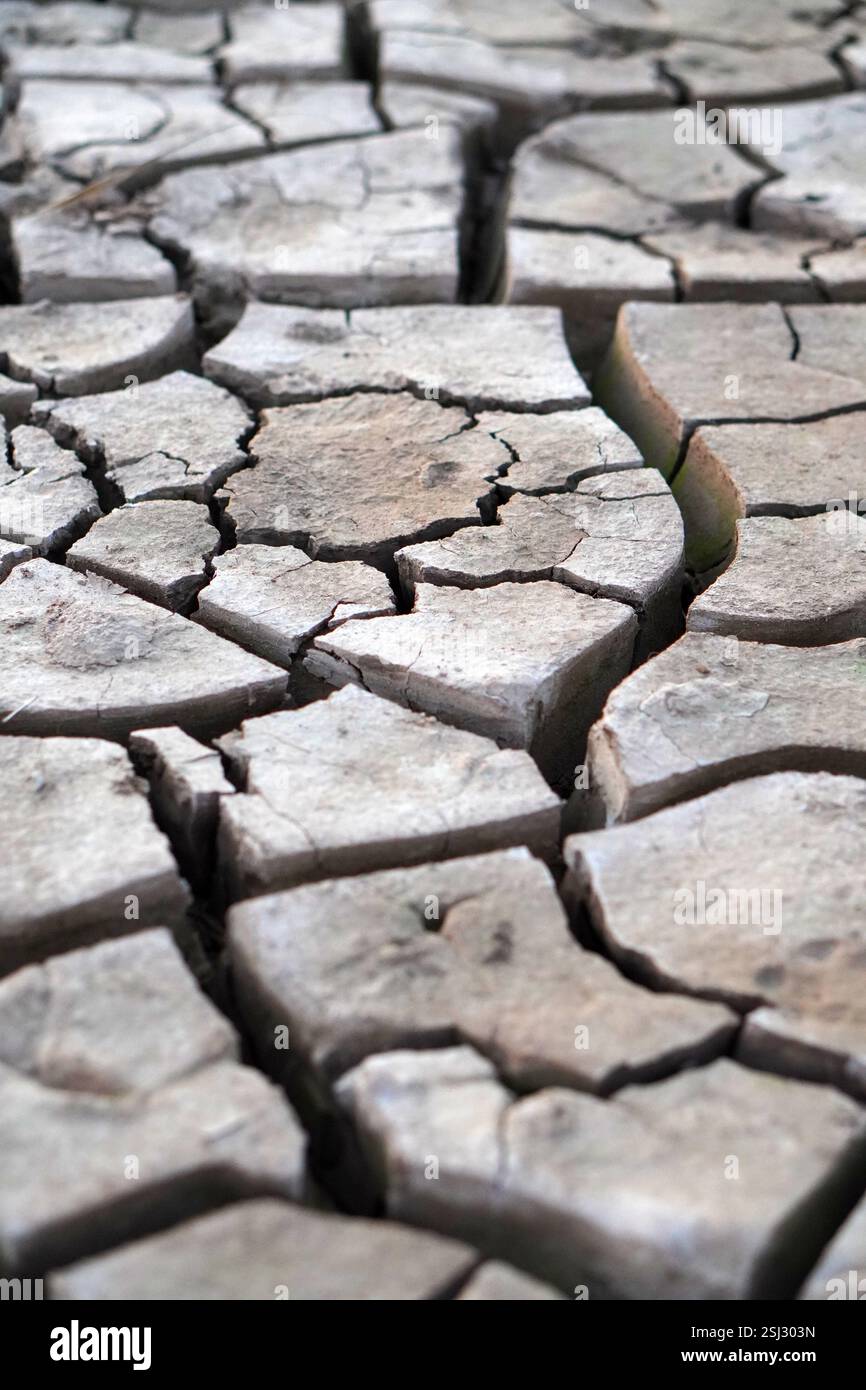 deep cracks in the earth with no vegetation, caused by drought and ...