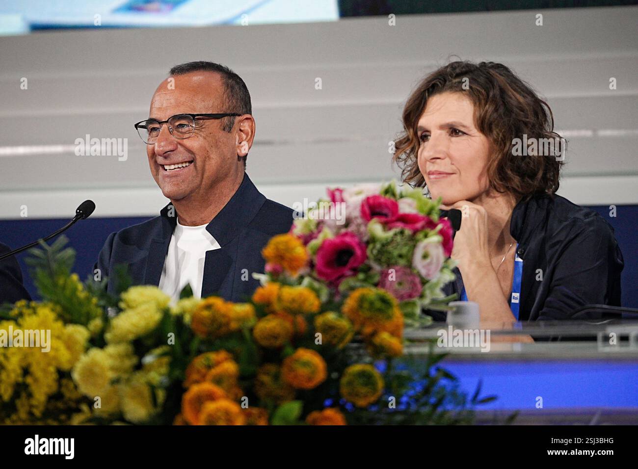 Carlo Conti, Elena Capparelli attend the press conference at 75th ...