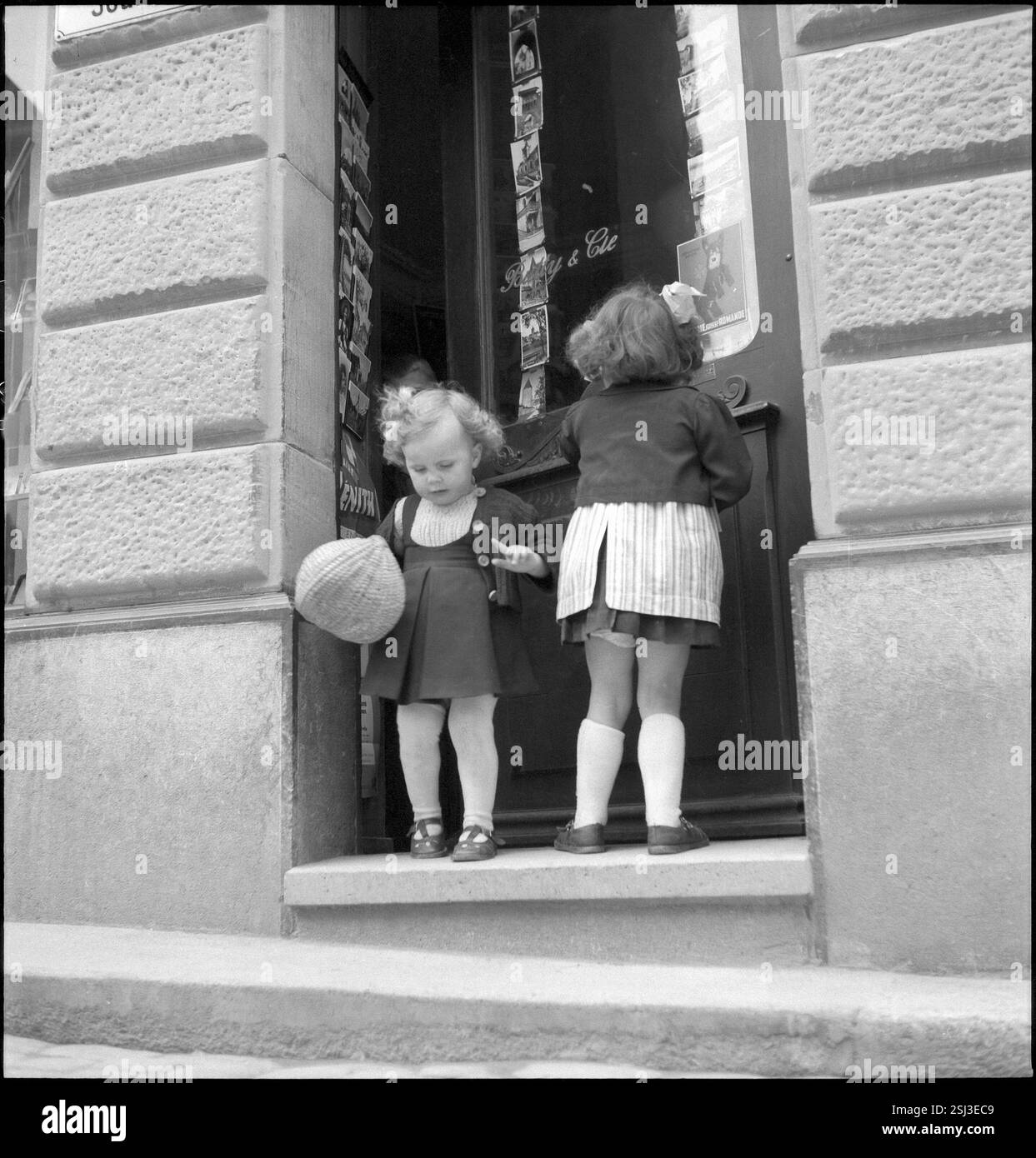 Child ringing doorbell Black and White Stock Photos & Images - Alamy