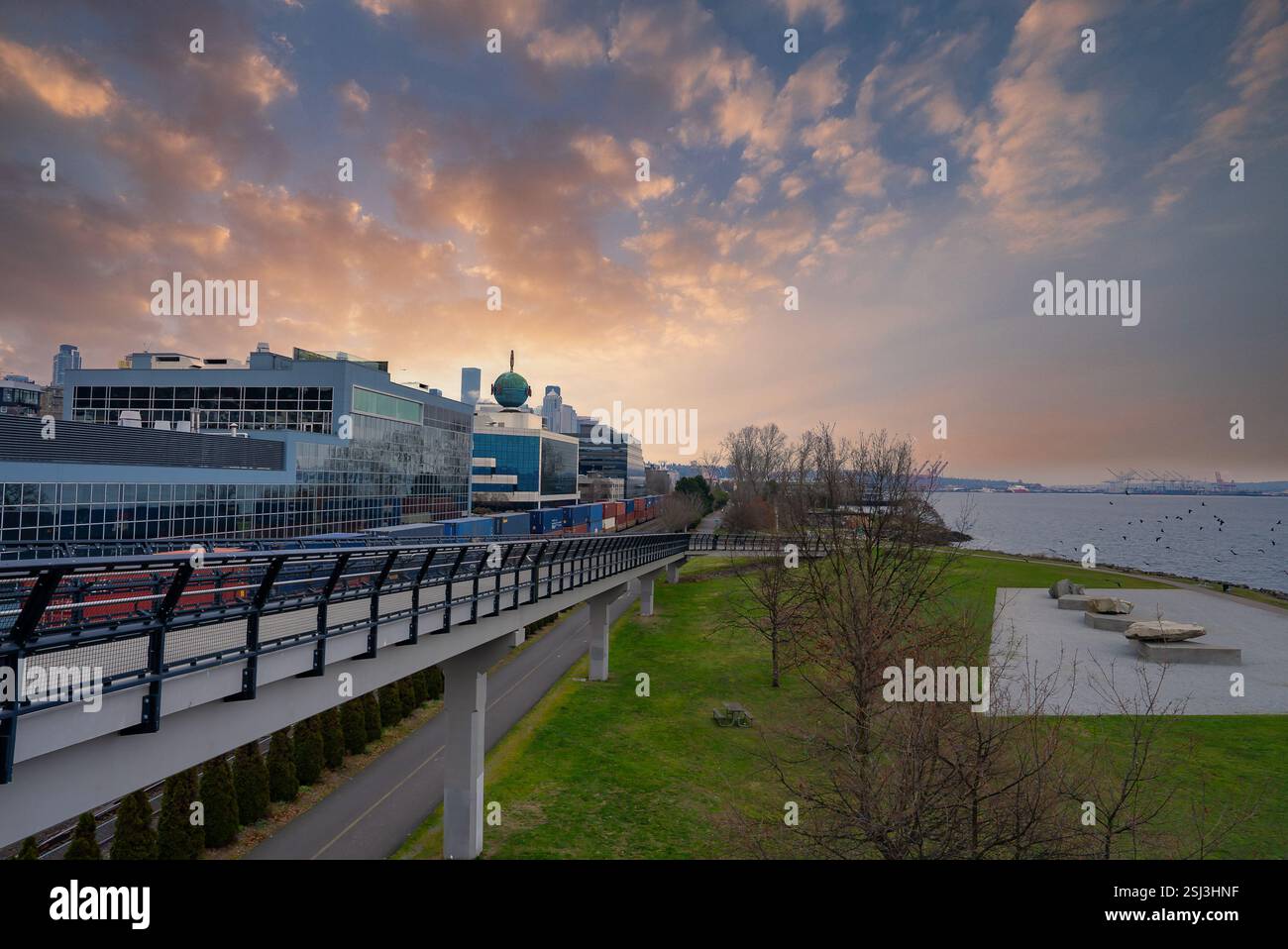 Seattle Waterfront at Sunset with Elevated Walkway and Green Dome Stock ...