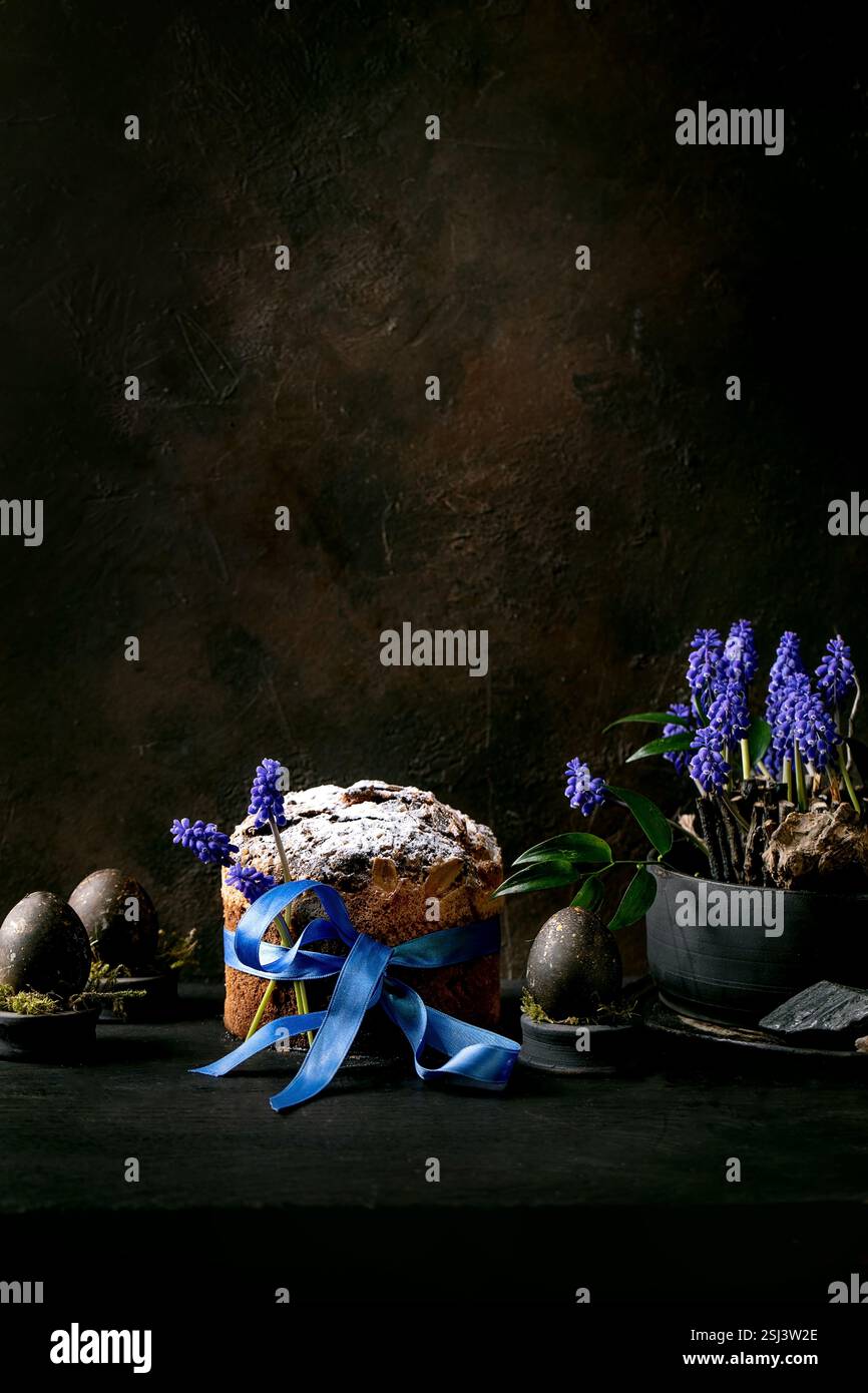Homemade traditional Easter panettone cake with blue ribbon, colored ...
