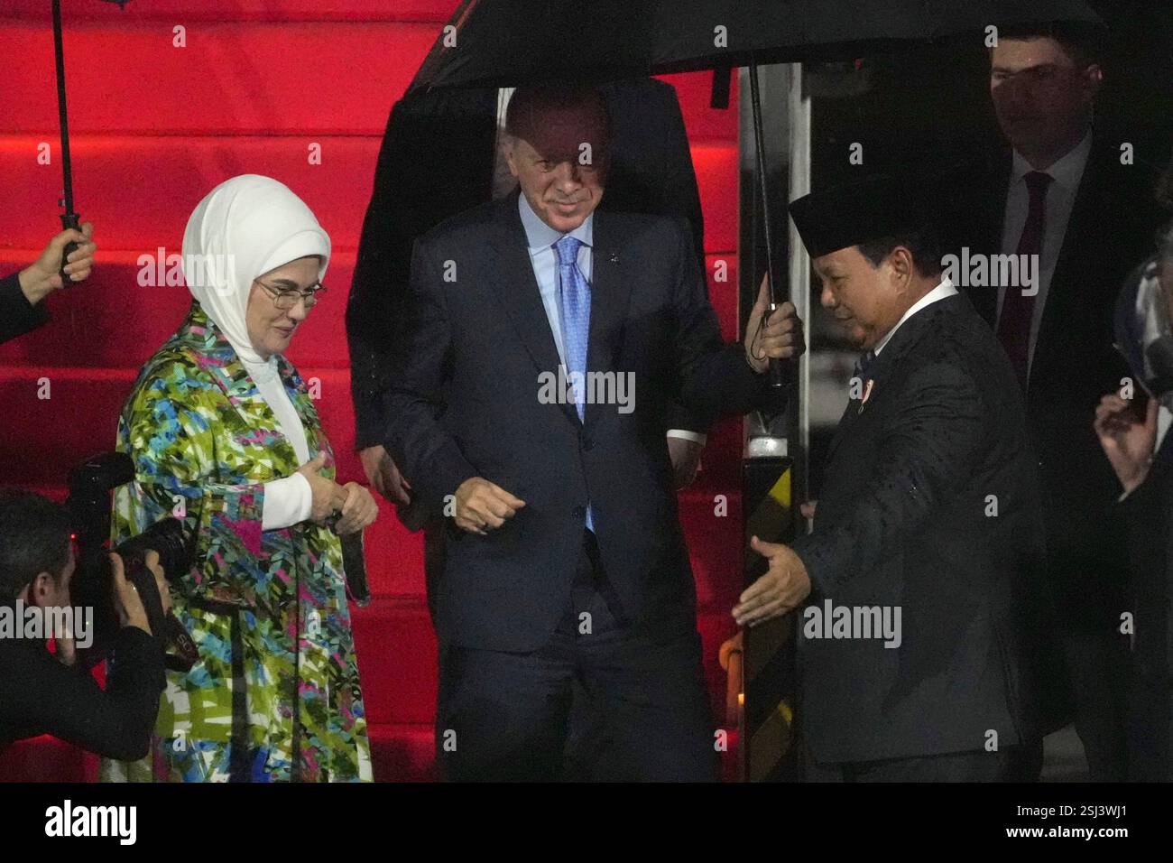 Indonesian President Prabowo Subianto, right greets Turkey's President ...