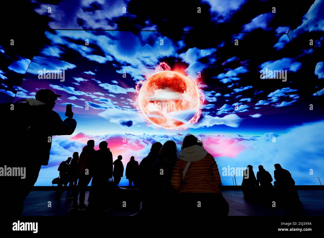 Visitors view displays at the free public galleries at Outernet ...